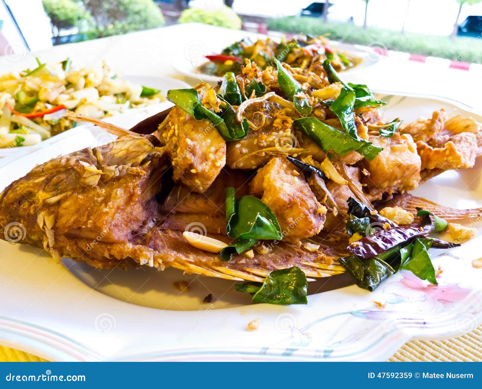 Fried Mango Fish, Topped with Herbs and Nut Stock Image - Image of ...