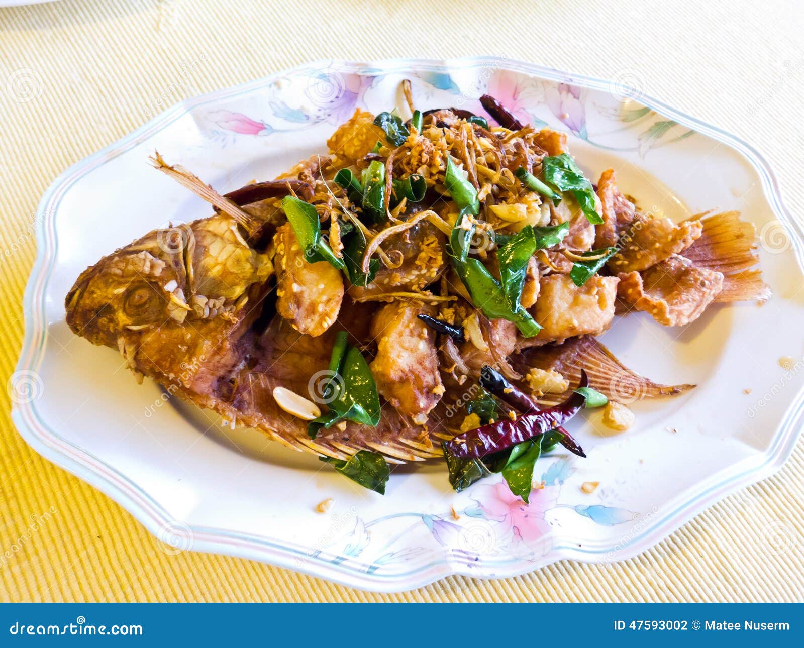 Fried Mango Fish, Topped with Herbs and Nut Stock Photo - Image of ...