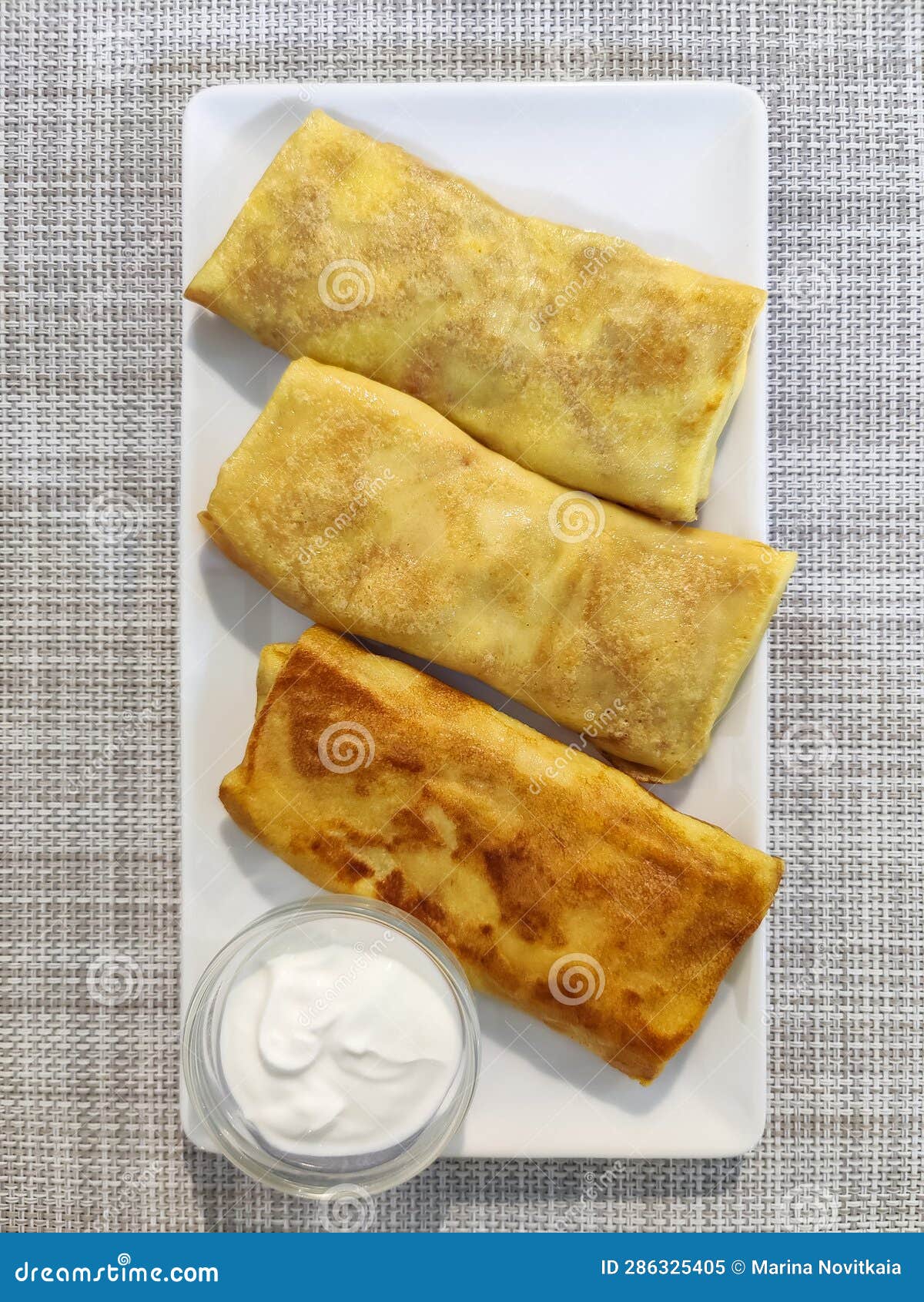 Fried Pancakes Stuffed with Meat and Sour Cream. Placed on a ...