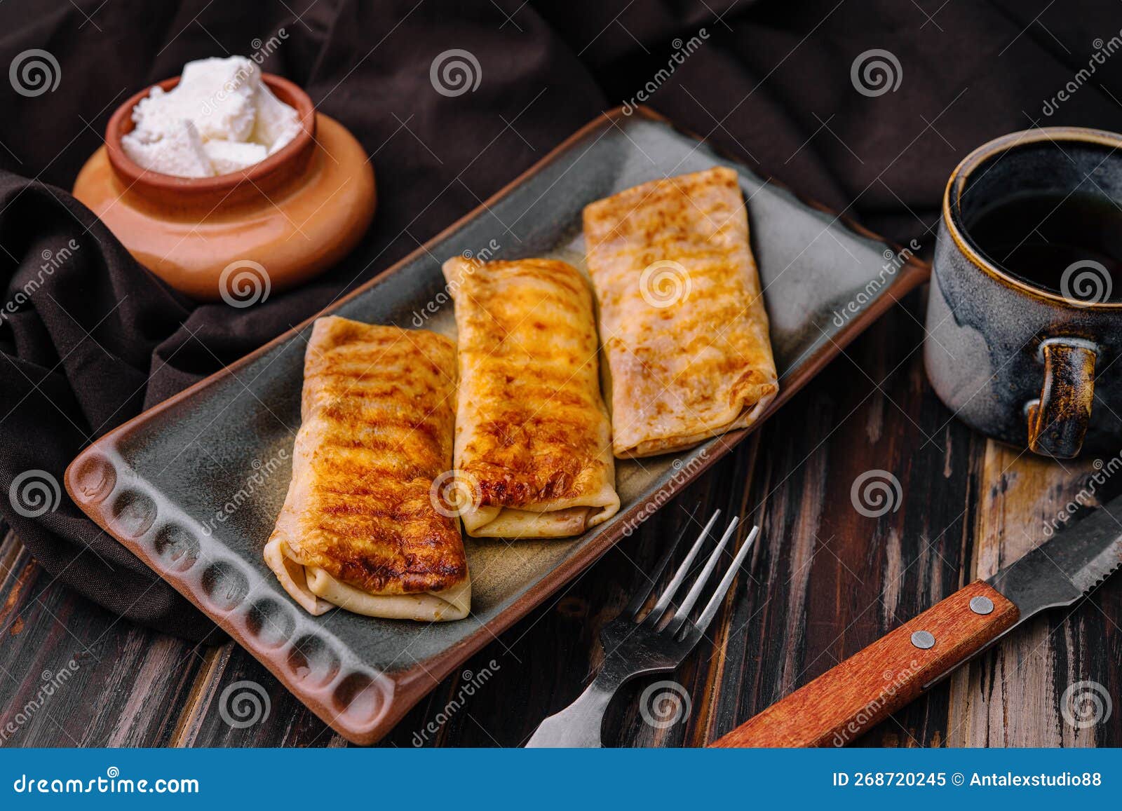 Fried Pancakes Twisted with Meat Inside on a Plate Stock Image - Image ...
