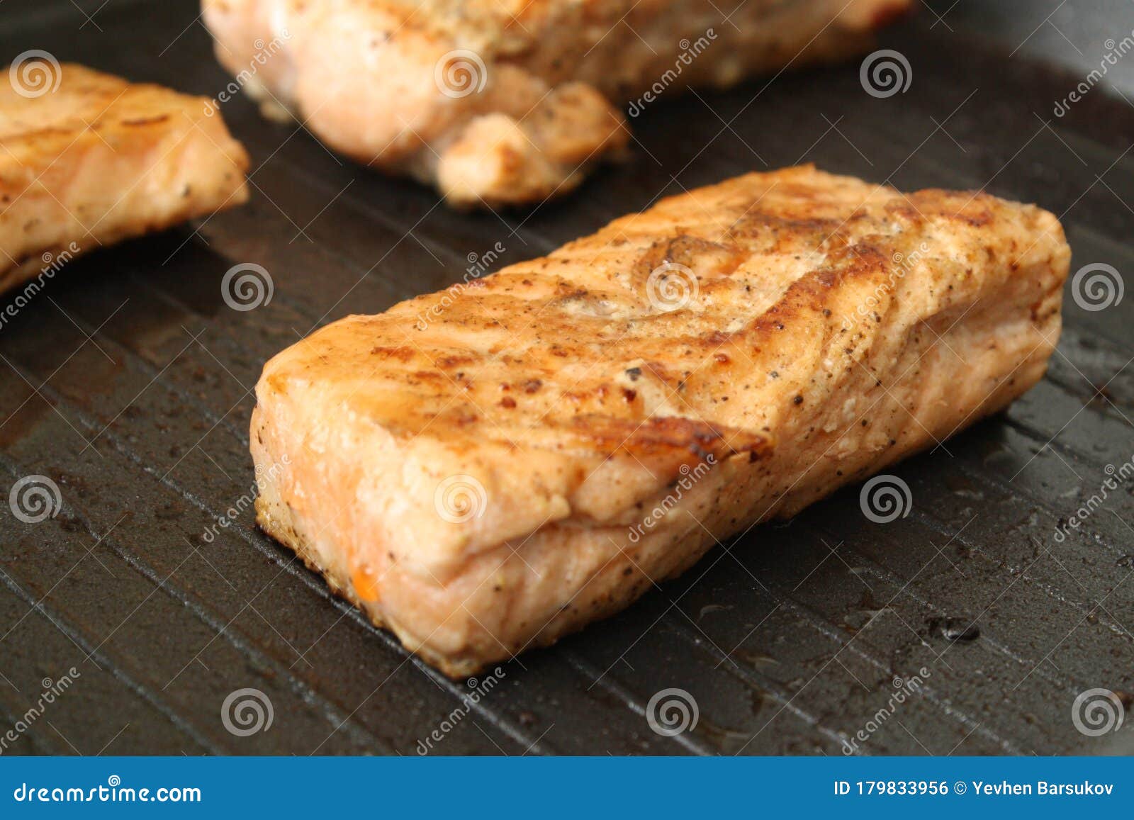 Fried Pieces of Fish in a Grill Pan Stock Photo - Image of black ...