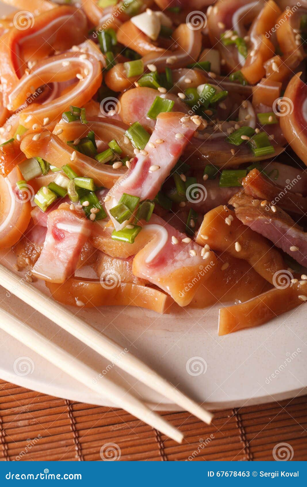 Fried Pig Ears with Sesame Seeds on a Plate Macro. Vertical Stock Image ...