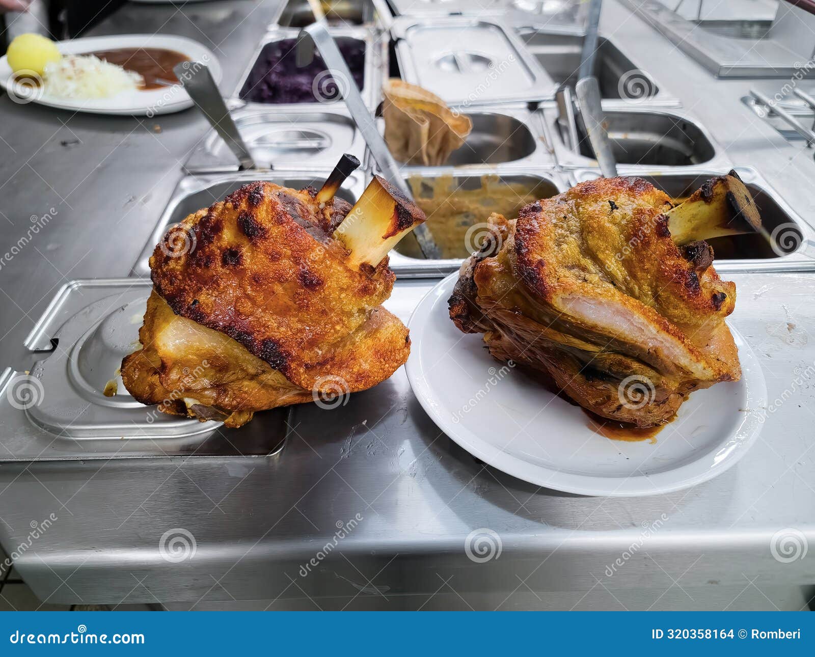 Fried Pork Knuckle on a Plate in the Kitchen of a Restaurant before ...