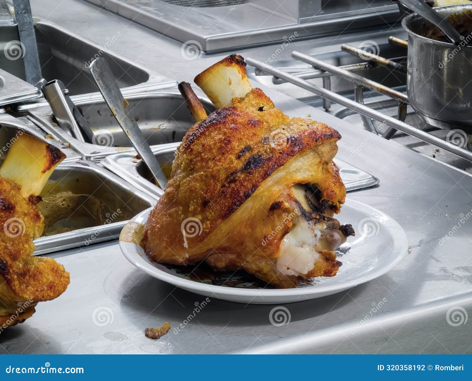 Fried Pork Knuckle on a Plate in the Kitchen of a Restaurant before ...