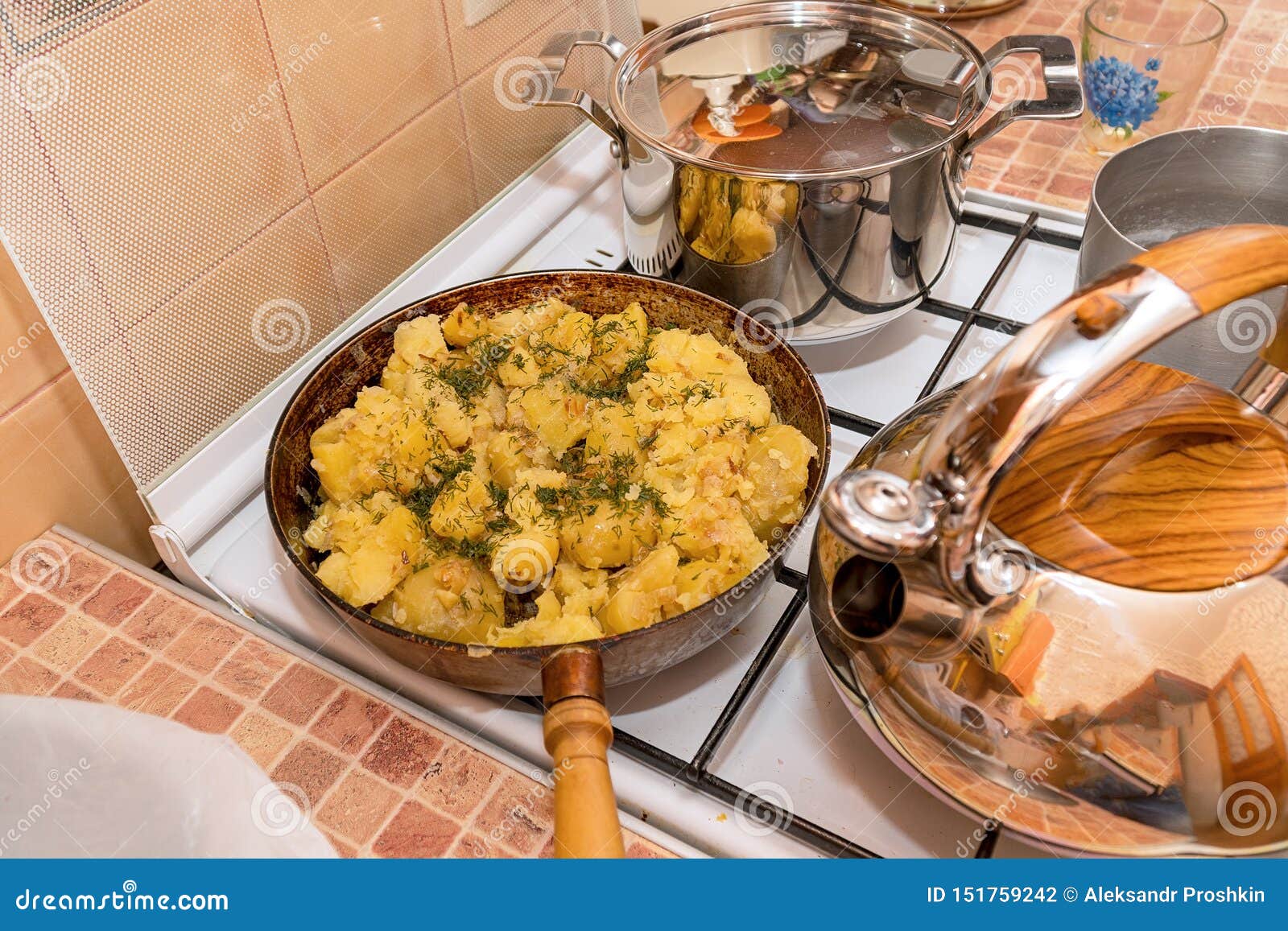 Fried Potatoes with Dill in a Pan on Gas Stove Stock Photo - Image of ...