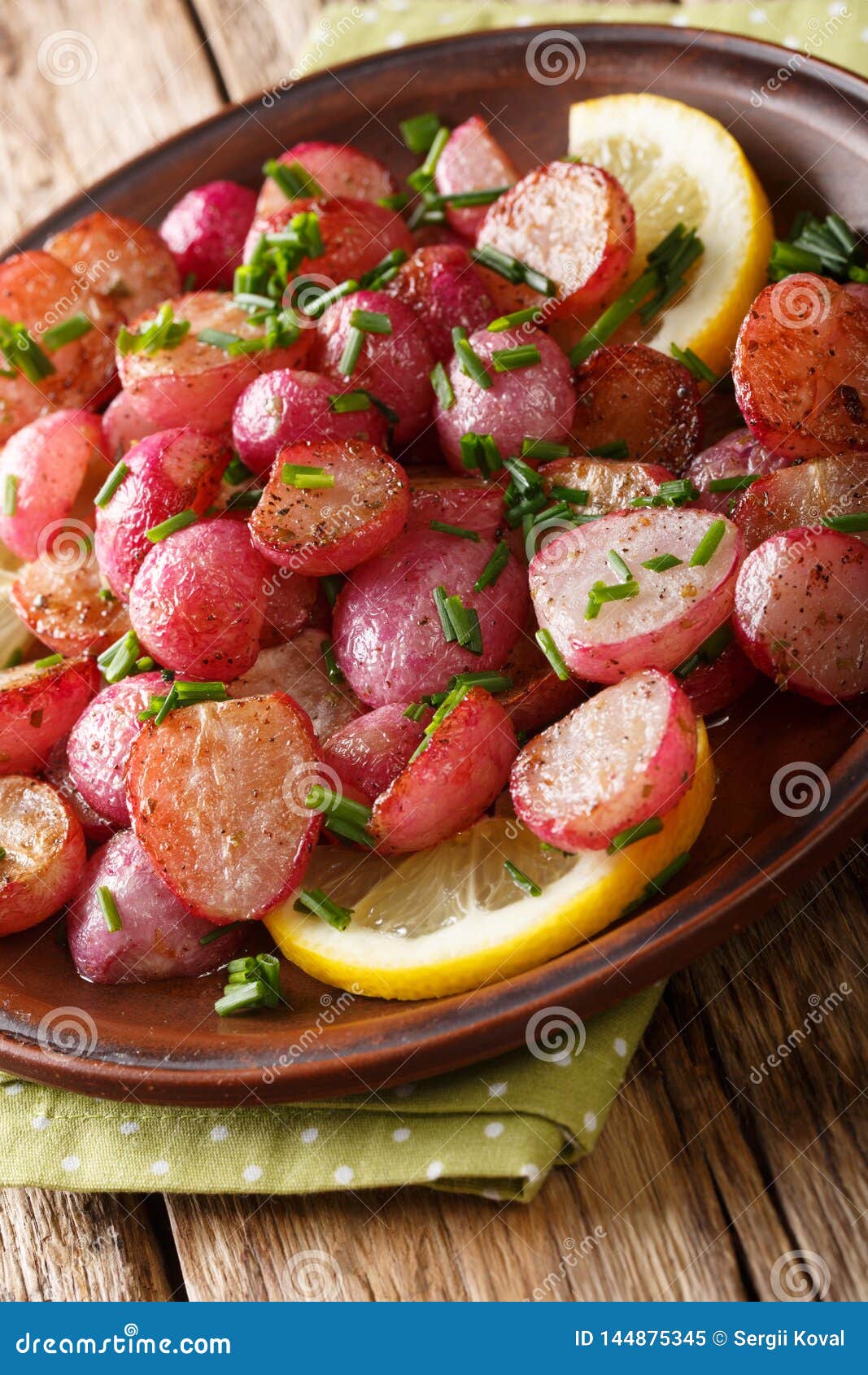 Fried Radish with Lemon and Green Onions Close-up on a Plate. Vertical ...