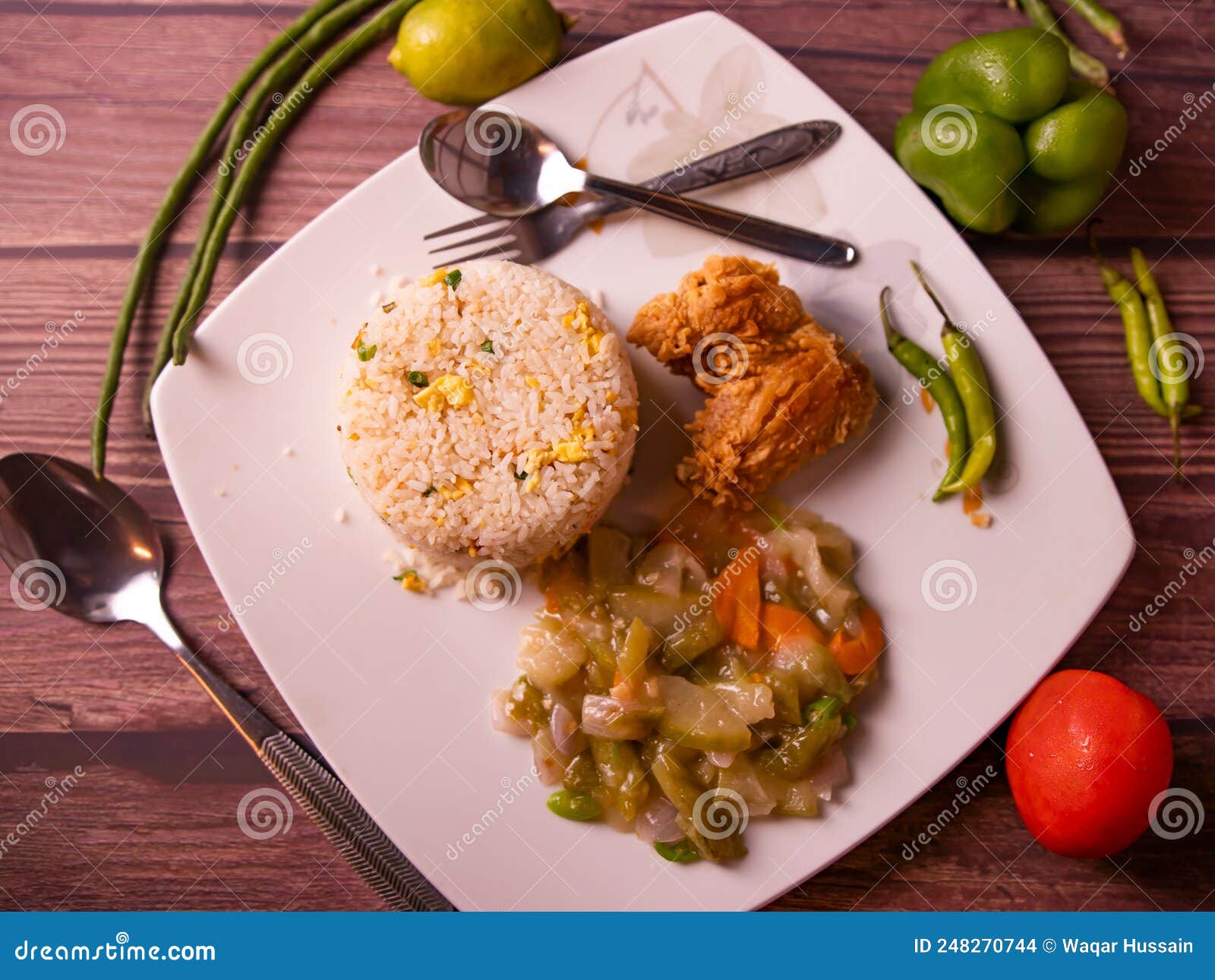 Fried Rice with Fried Chicken in a Dish Top View on Wooden Background ...