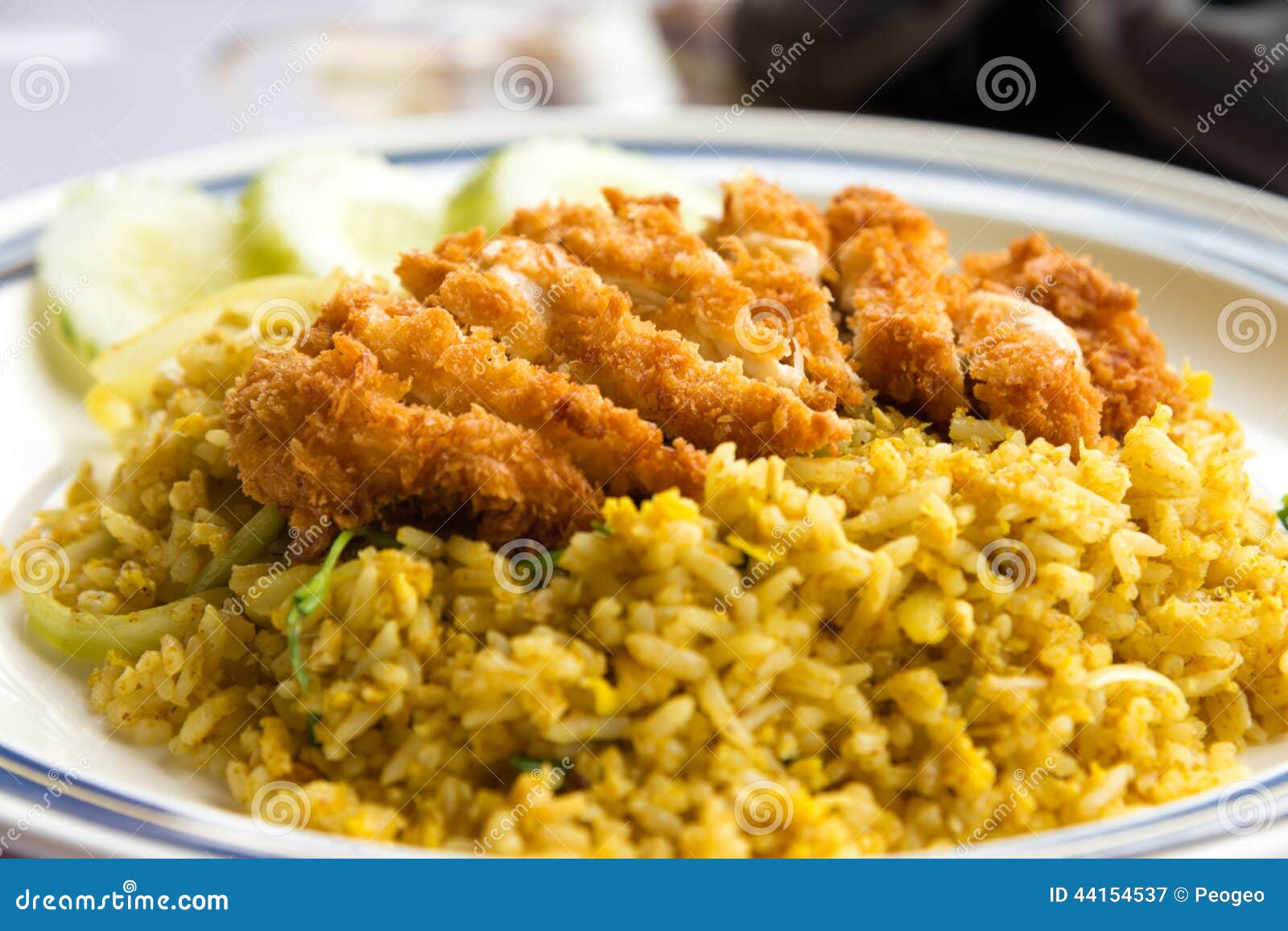 Fried Rice with Crispy Chicken Stock Image - Image of asian, cucumber ...
