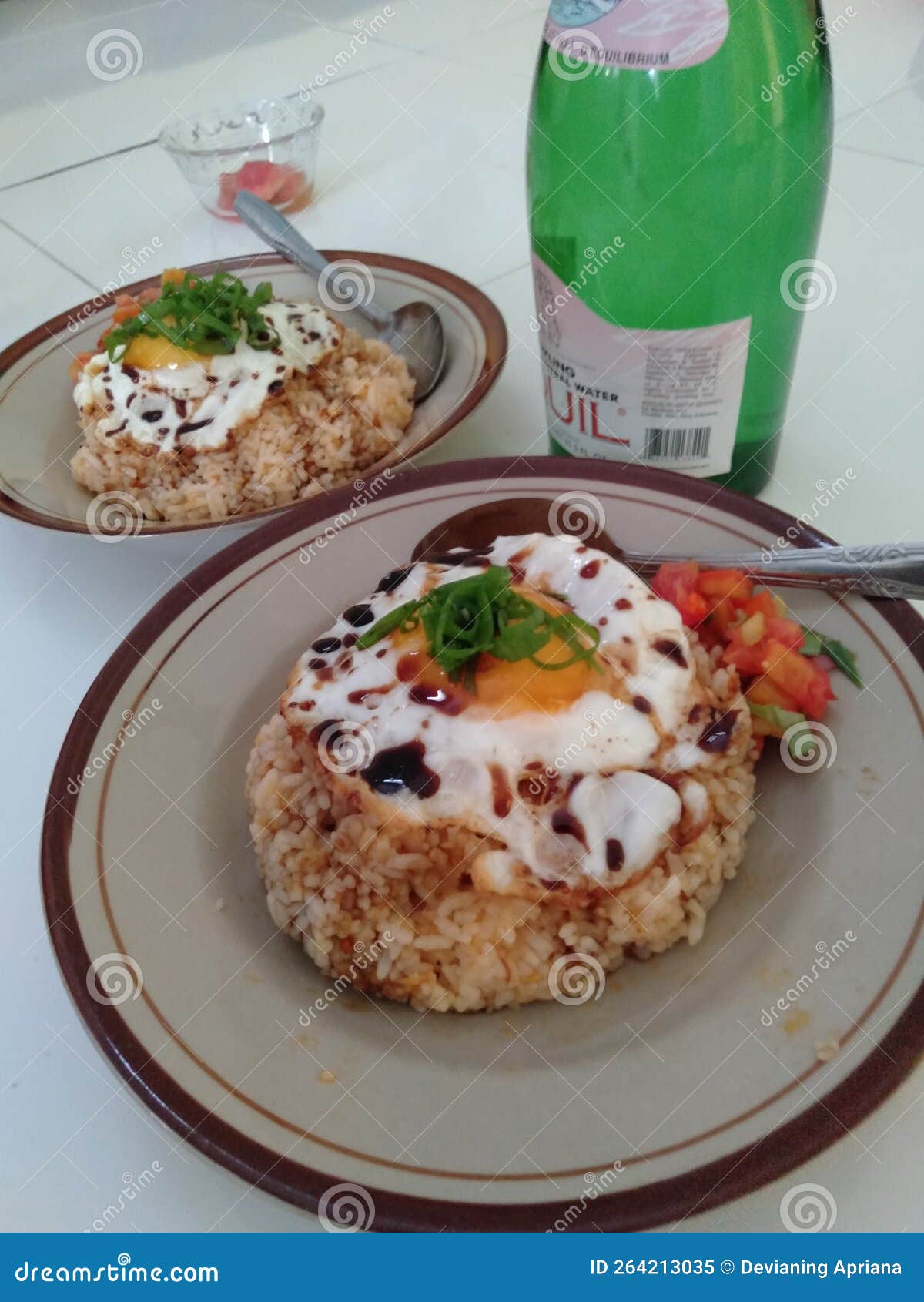 Fried Rice with Egg on Top of it with Tomato Pickles Stock Image ...