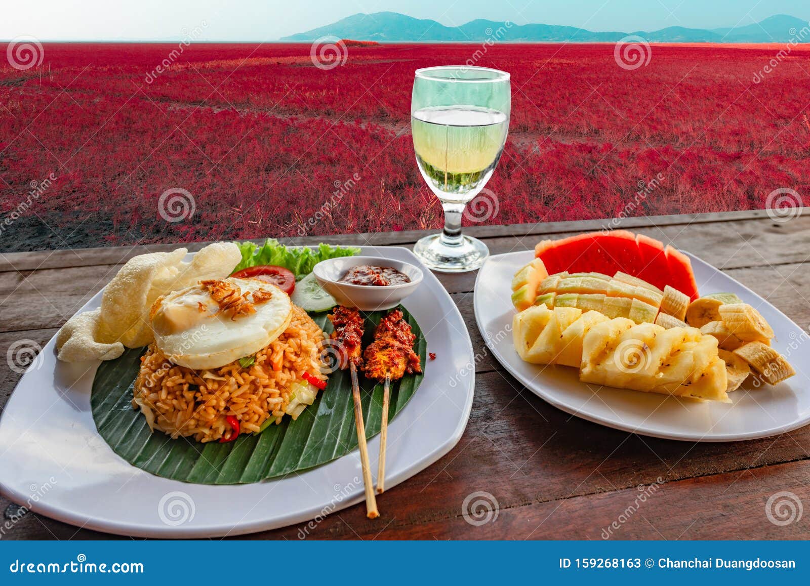 Fried Rice and Fruit on the Table Red Grassland Stock Image - Image of ...