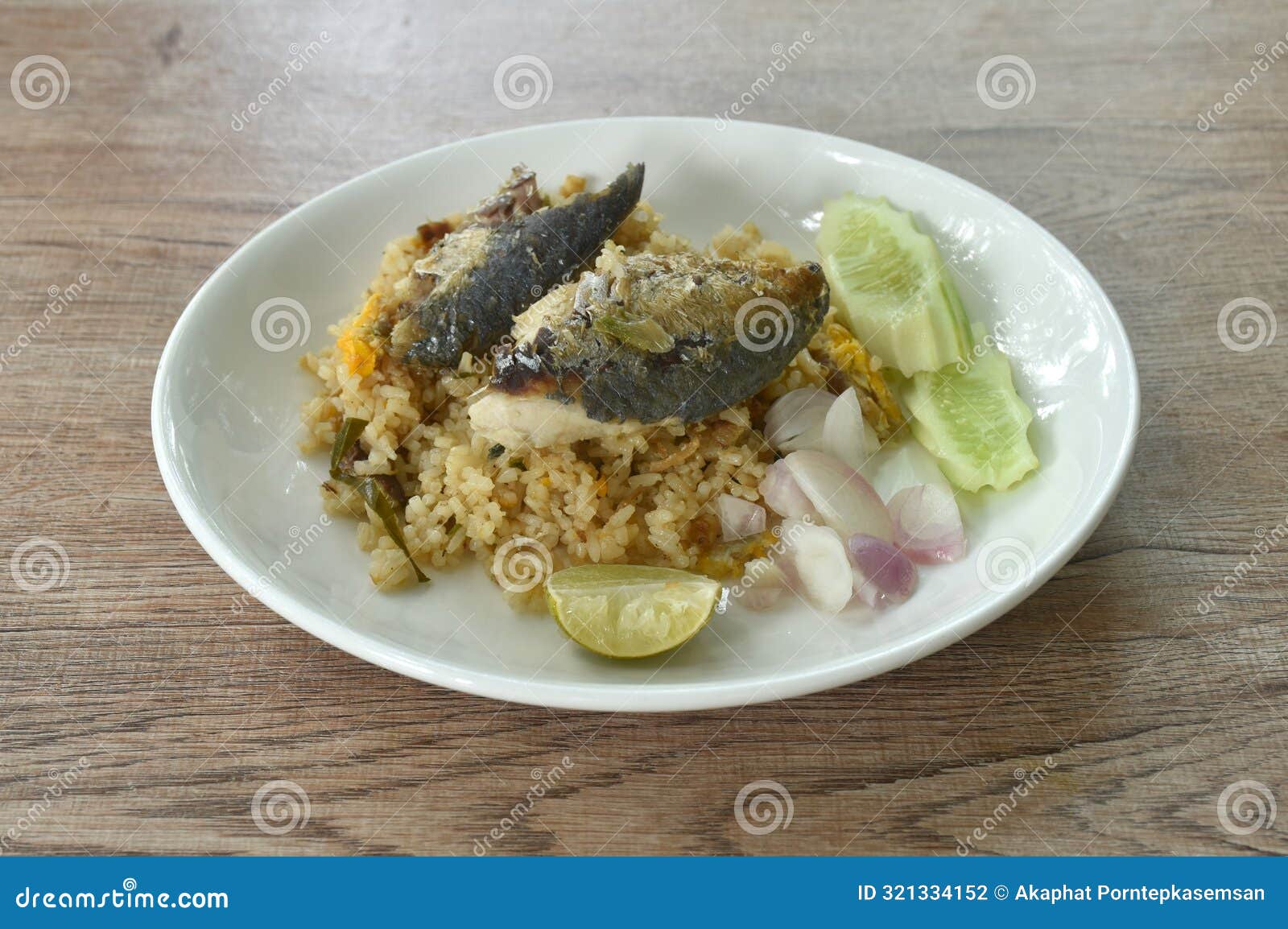 Fried Rice Mackerel Fish Couple Egg with Slice Cucumber and Lemon on ...