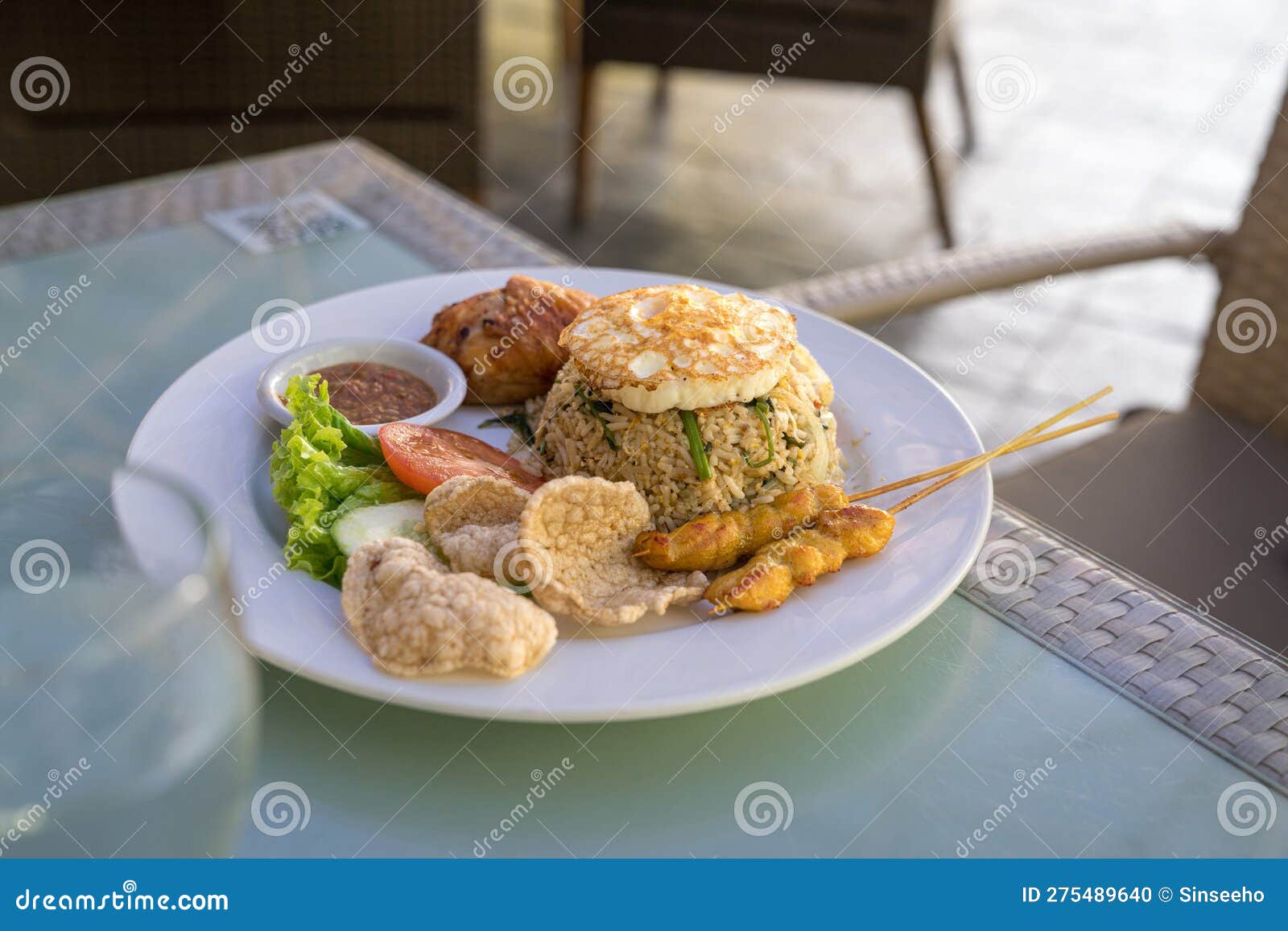 Fried Rice Served with Fried Chicken, Fried Egg and Satay Stock Photo ...
