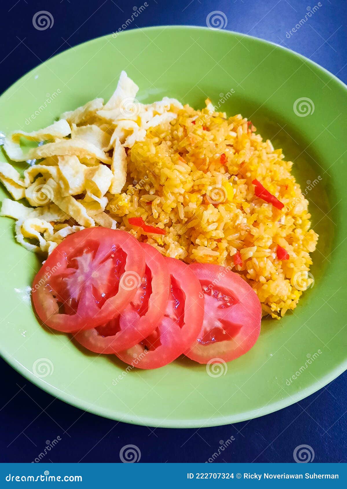 Fried Rice with Tomato and Fried Egg Topping Stock Photo - Image of ...