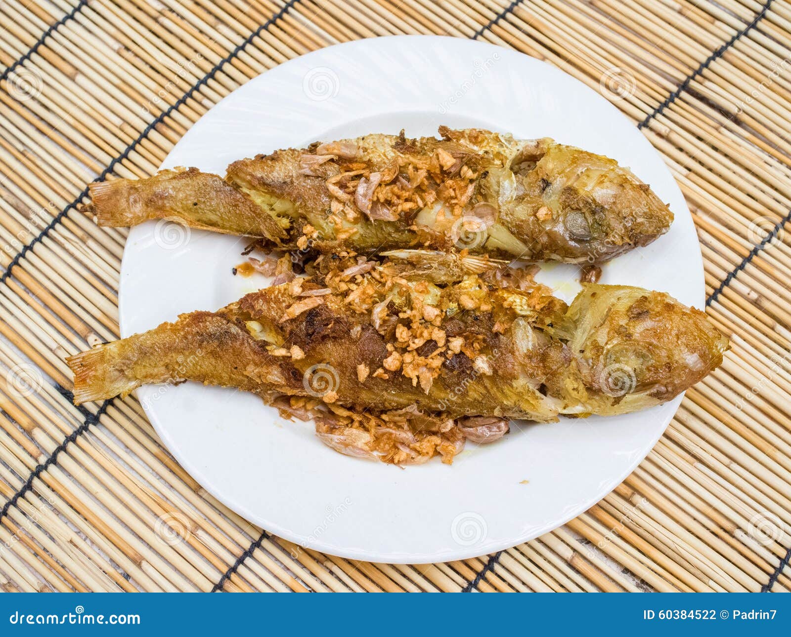 Fried Snapper Fish with Garlic on the Plate Stock Photo - Image of ...