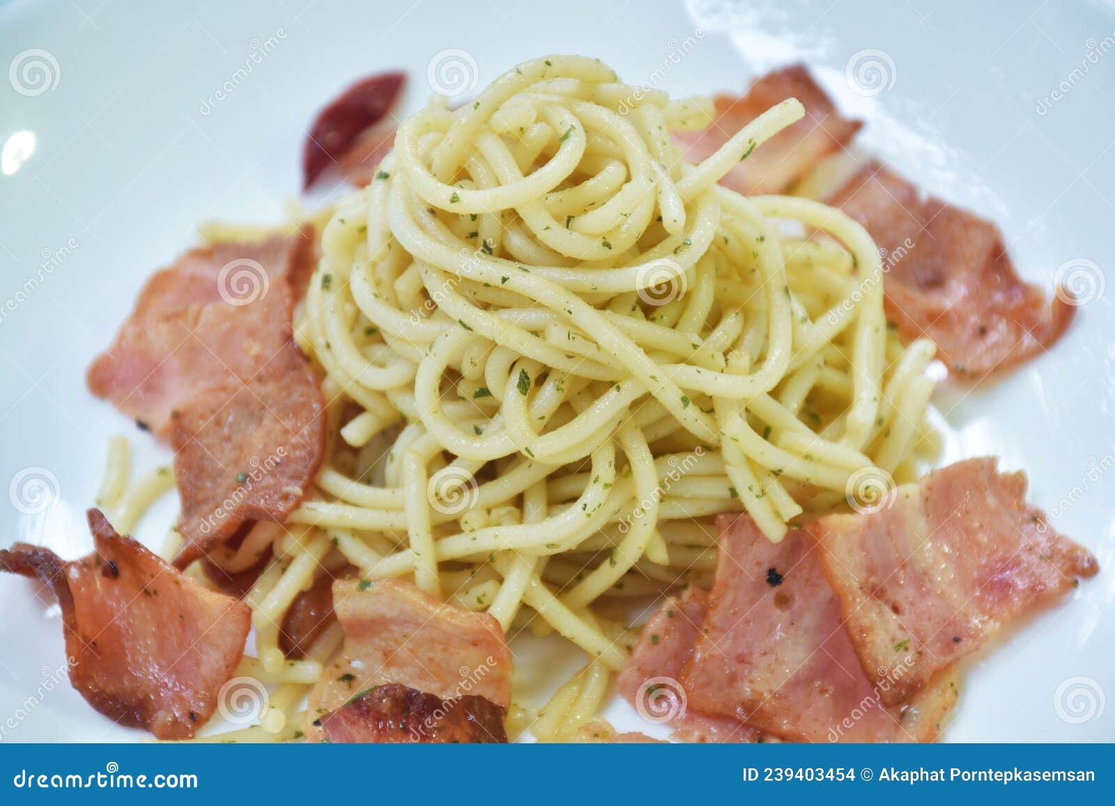 Fried Spaghetti Topping Crispy Bacon and Slice Dry Chili on Plate Stock ...