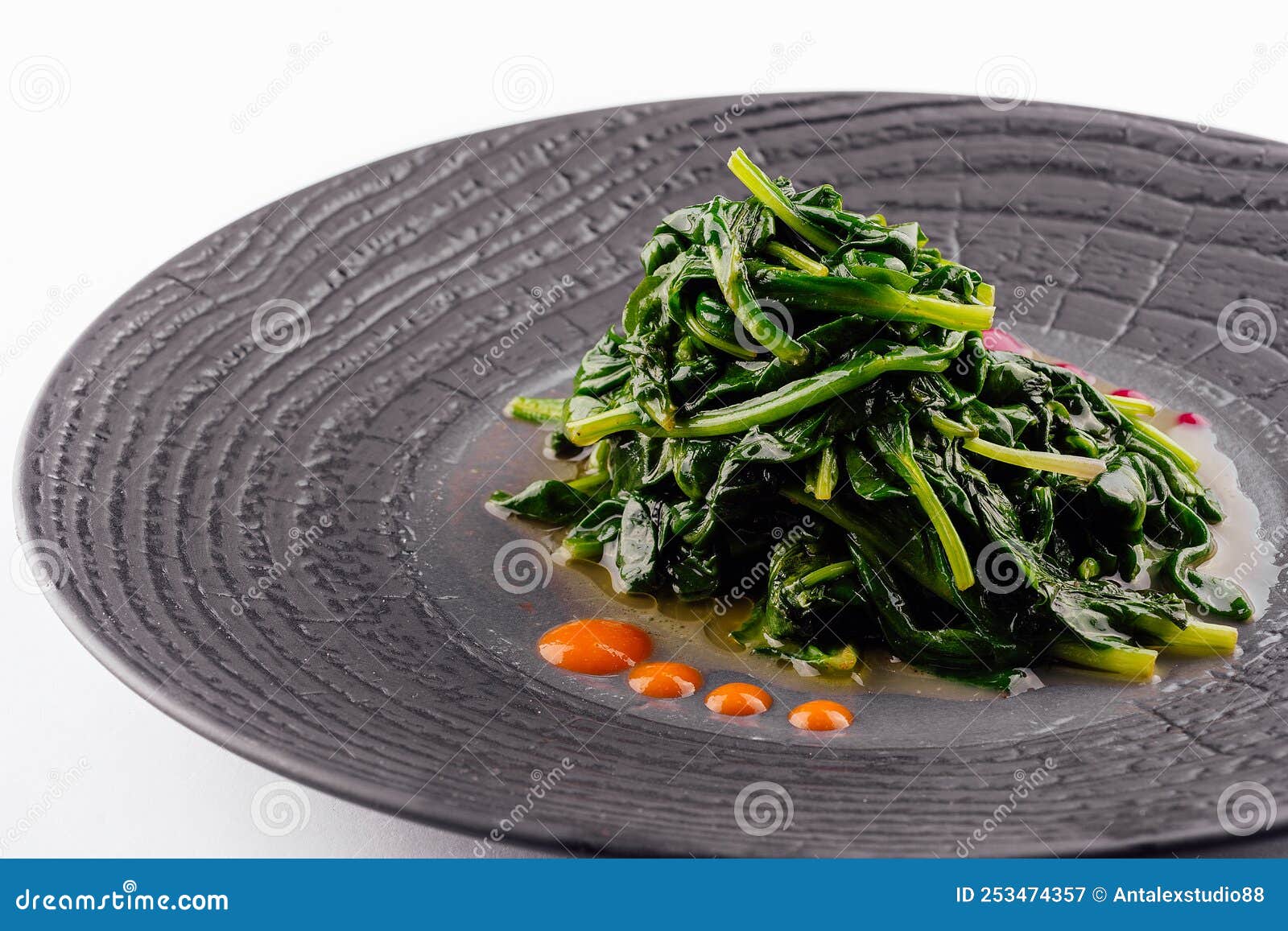 Fried Spinach on Black Plate Isolated Stock Image - Image of lunch ...