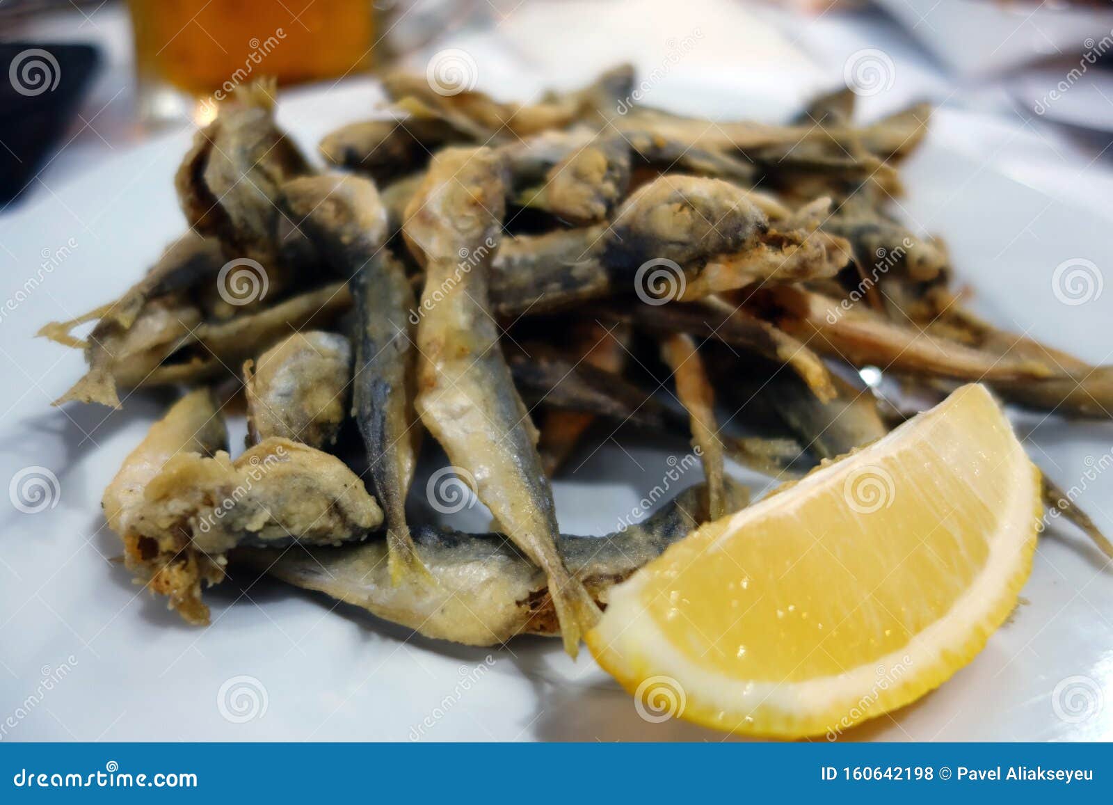 Fried sprat serving stock photo. Image of lemon, prepared - 160642198