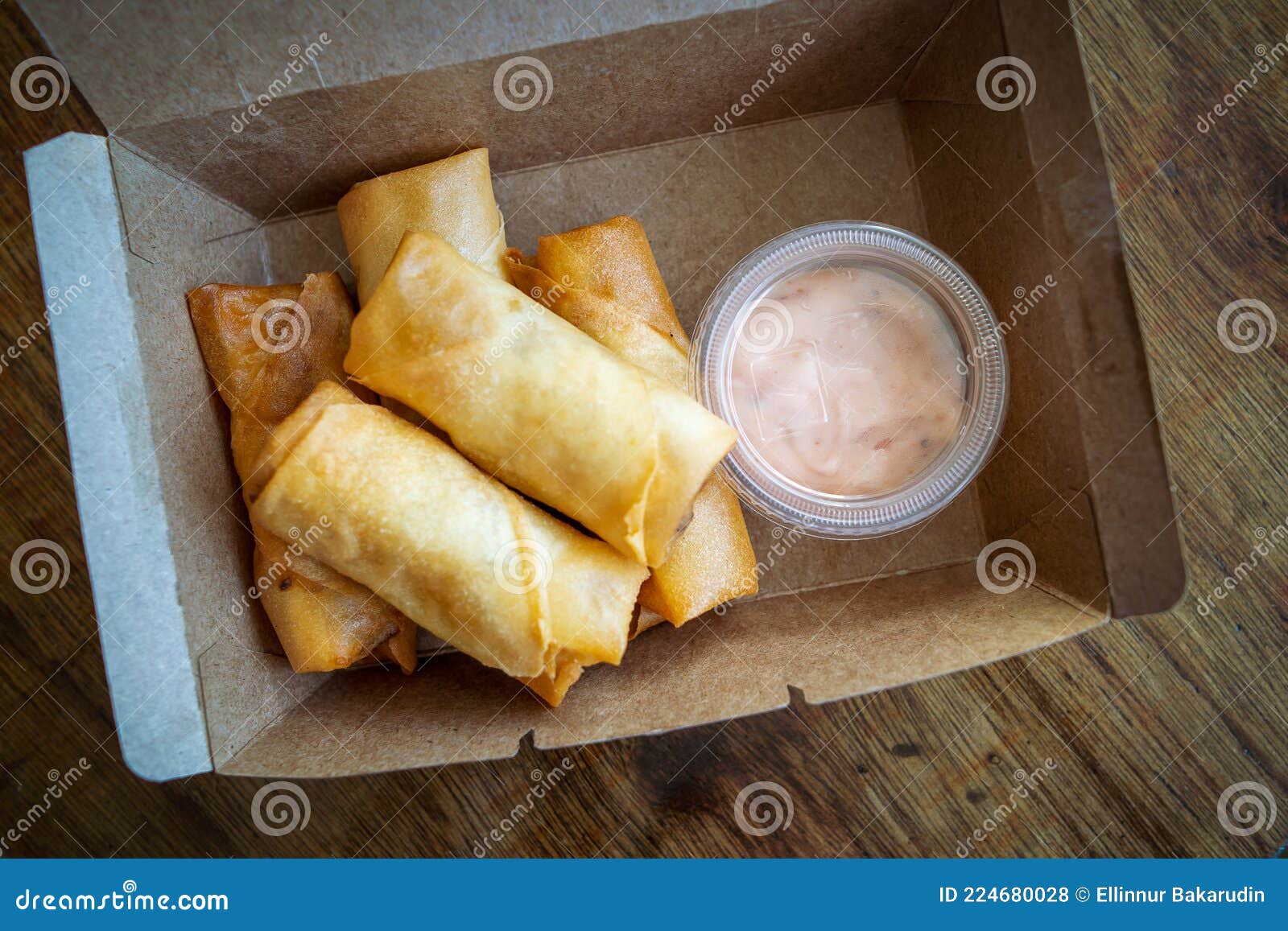 Fried Spring Rolls in a Brown Takeaway Container with Creamy Sauce ...
