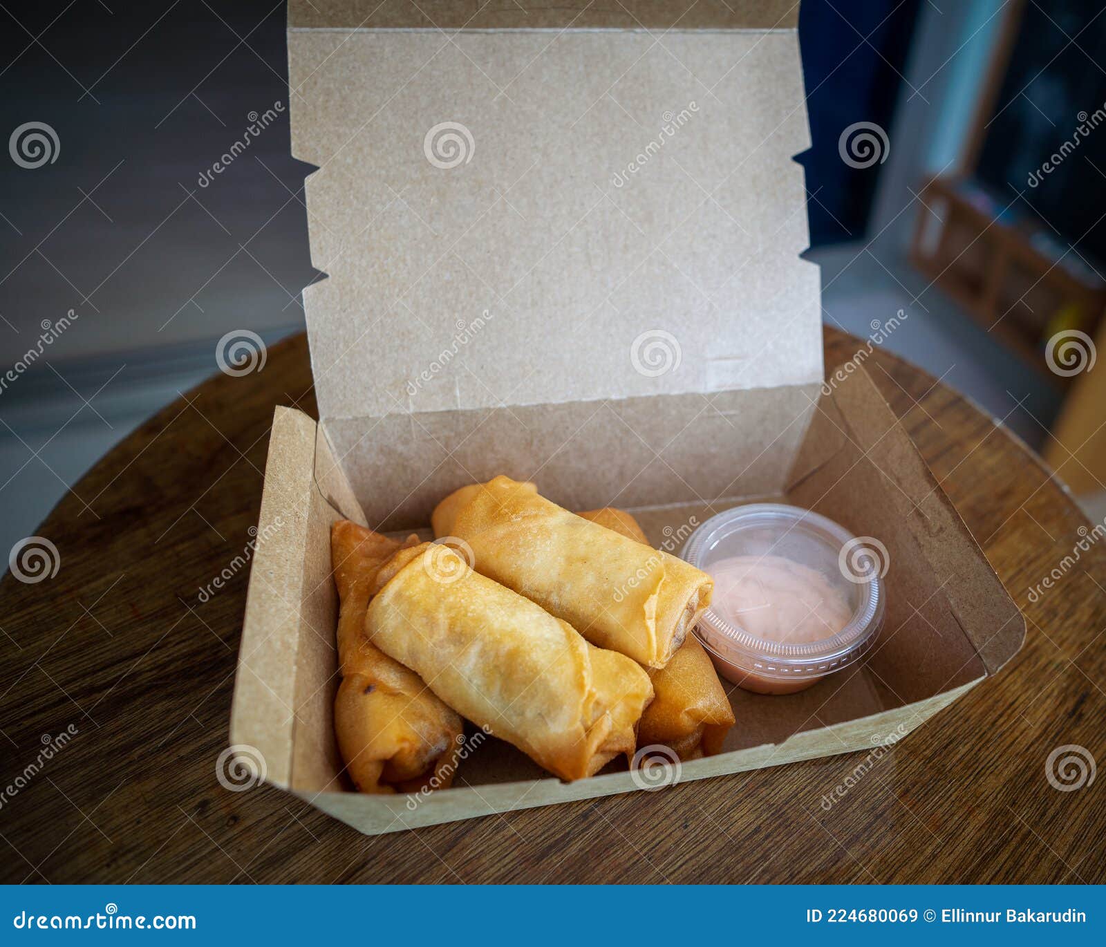 Fried Spring Rolls in a Brown Takeaway Container with Creamy Sauce ...
