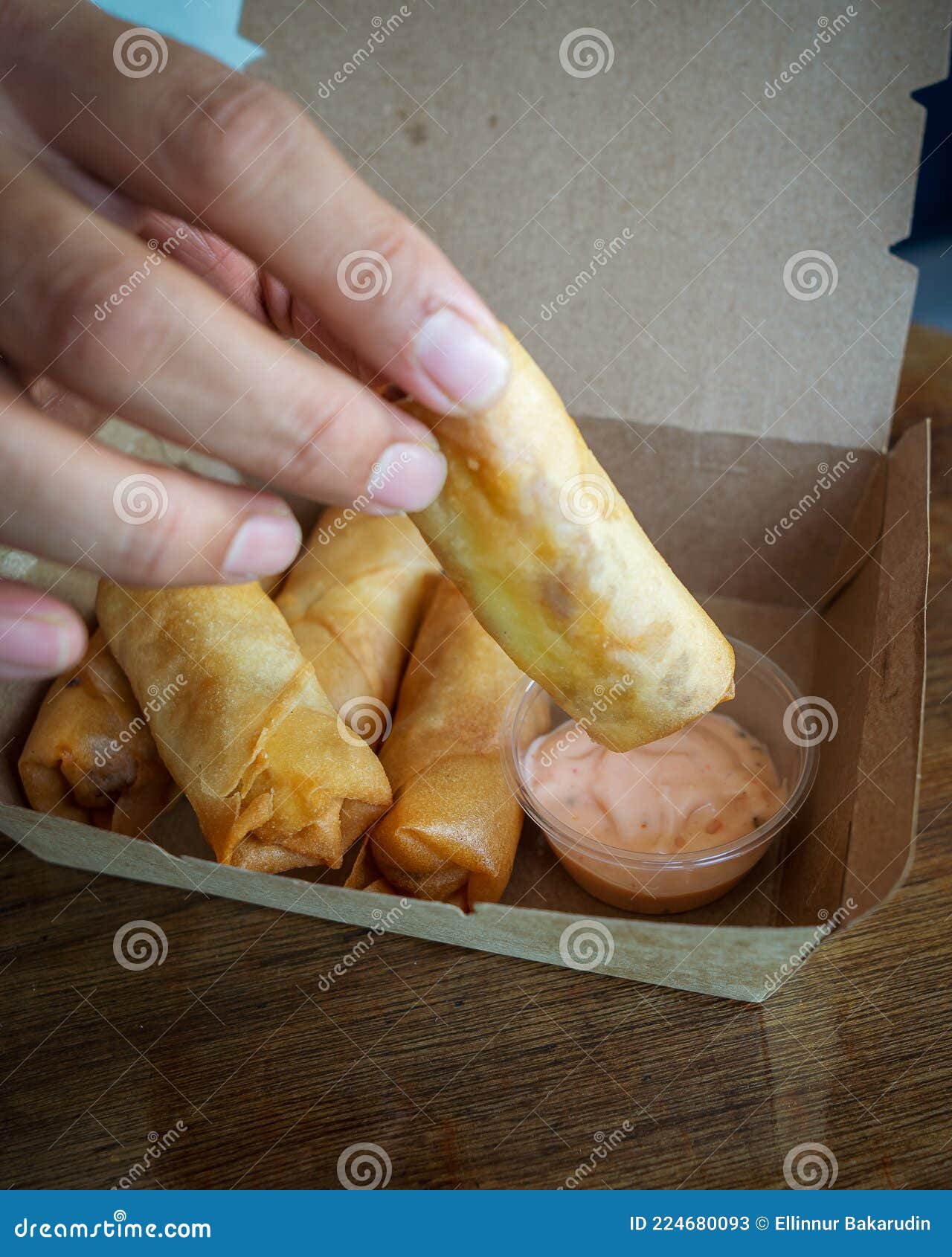 Fried Spring Rolls in a Brown Takeaway Container with Creamy Sauce ...