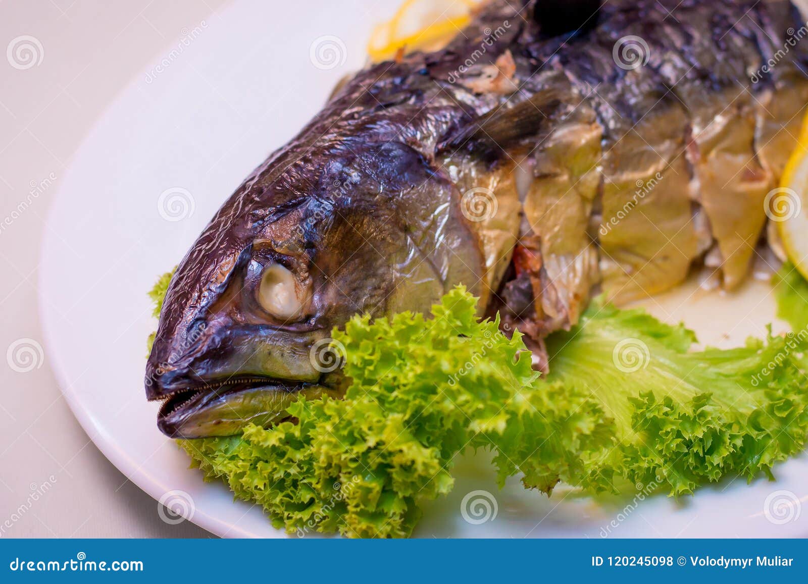 Fried Stuffed Fish at a Festive Table in the Restaurant_ Stock Photo ...