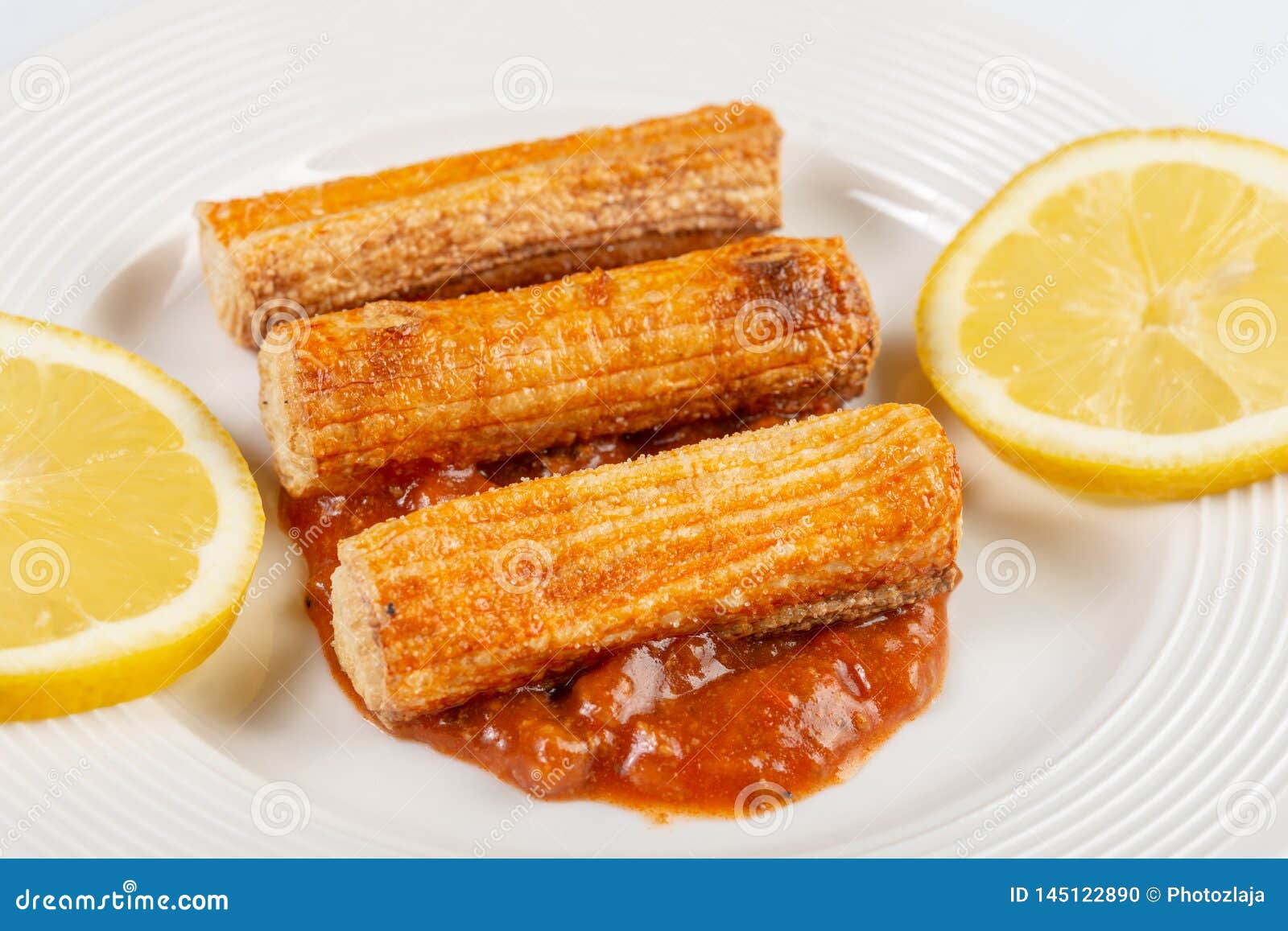 Fried Surimi Sticks with Lemons on the White Plate Stock Photo - Image ...