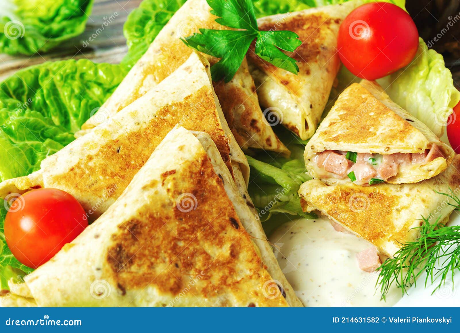Fried Triangular Tortilla with Sausage and Cheese in a Cut on a White ...