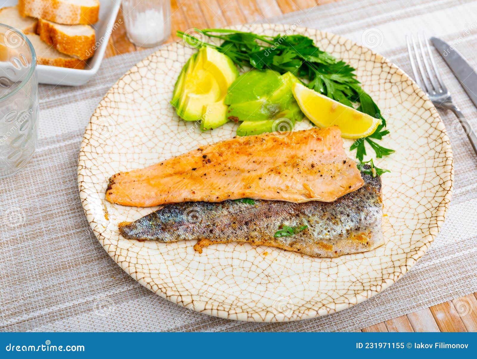 Fried Trout Fillet Served with Avocado is Healthy Dish in Kitchen Stock ...