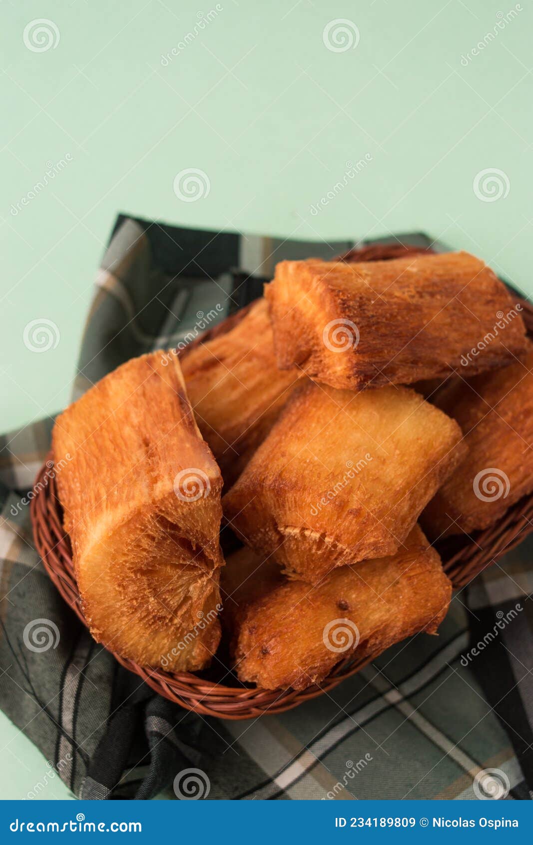Fried yucca in a basket stock image. Image of cheese - 234189809