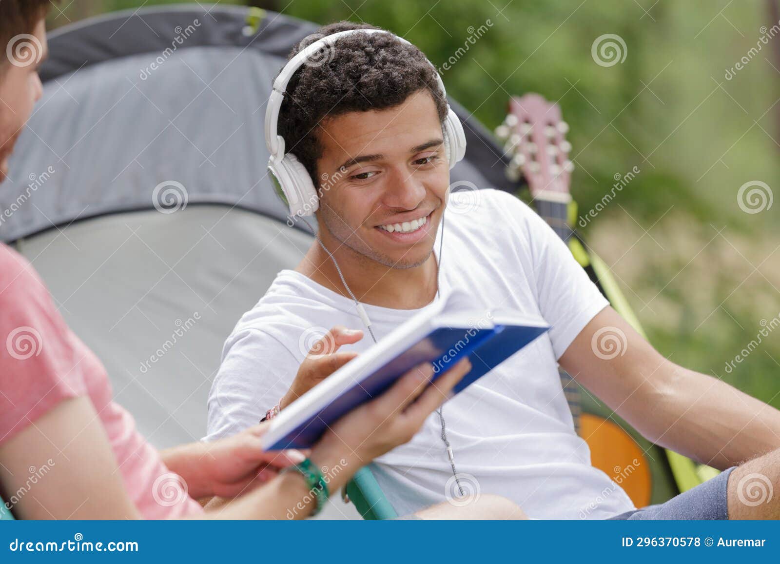 Friend Checking Writing Friend Outside Tent Stock Photo - Image of park ...