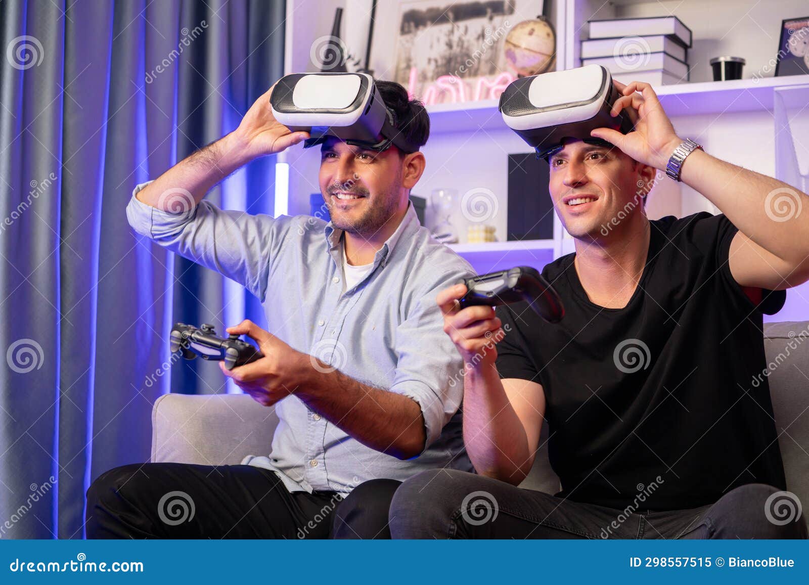 Friend Gamers Playing Video Game Using Joysticks and VR Headset ...