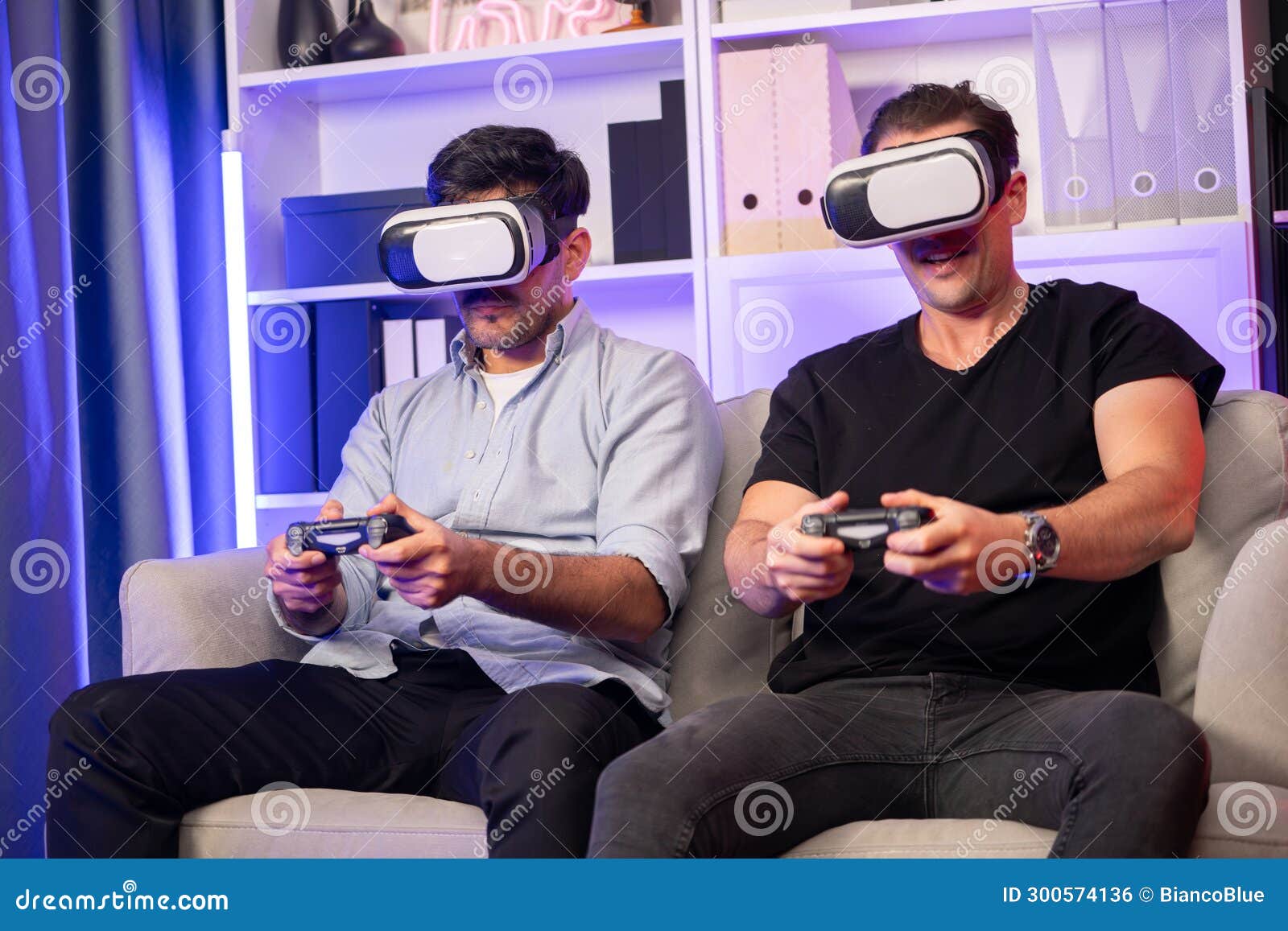 Friend Gamers Playing Video Game Using Joysticks and VR Headset ...
