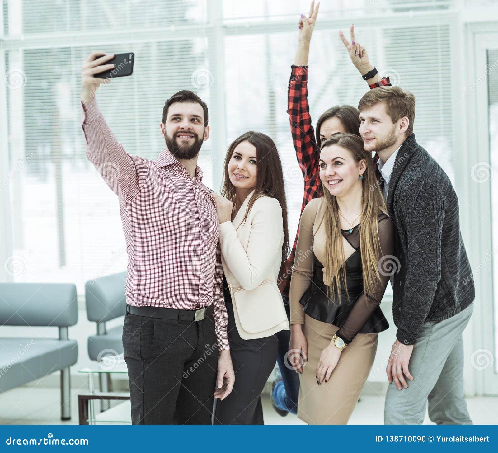 Friendly Business Team Taking a Selfie while Standing Near Window in ...