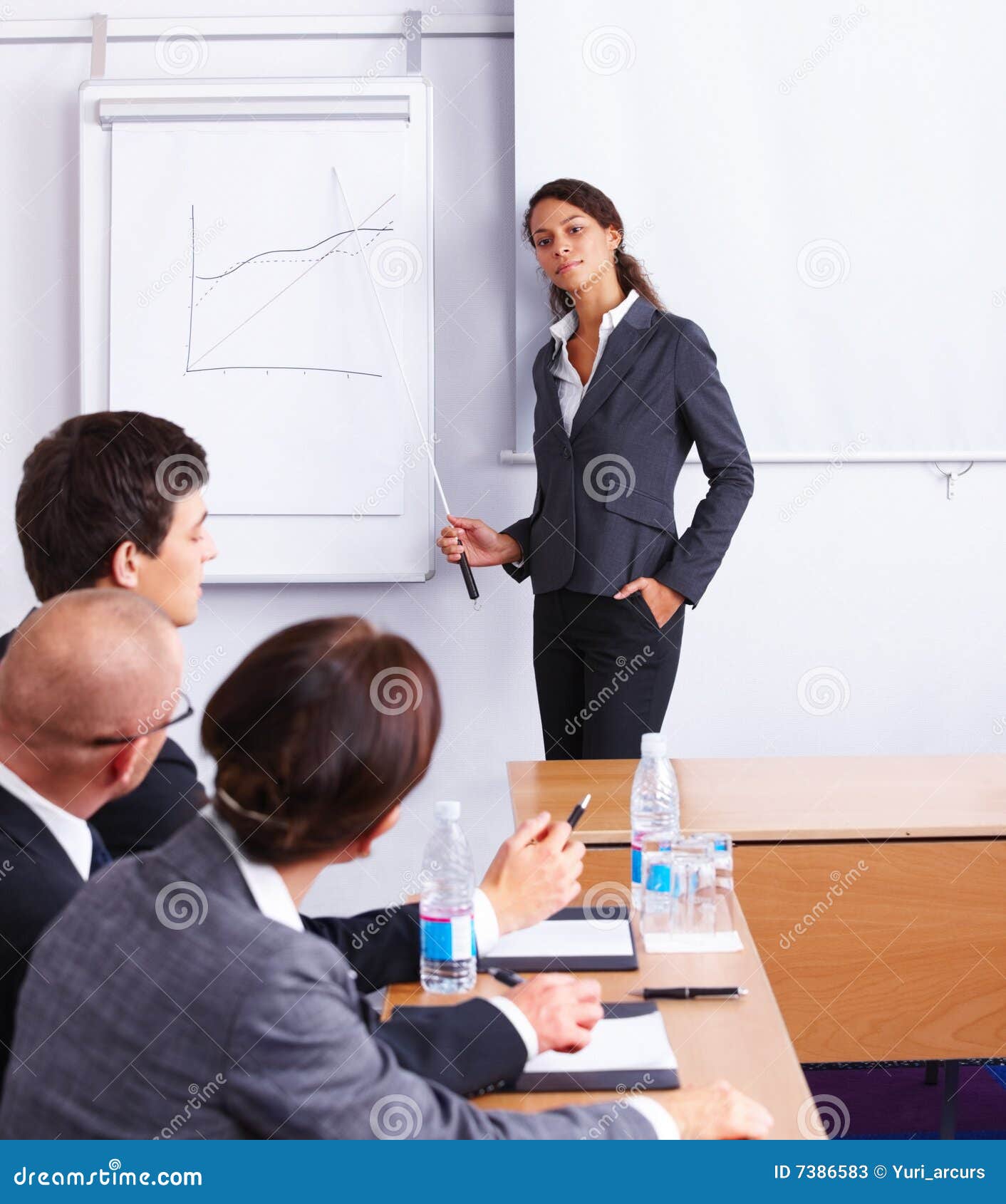 Stock Photos: Friendly business woman explaining graph. Image: 7386583