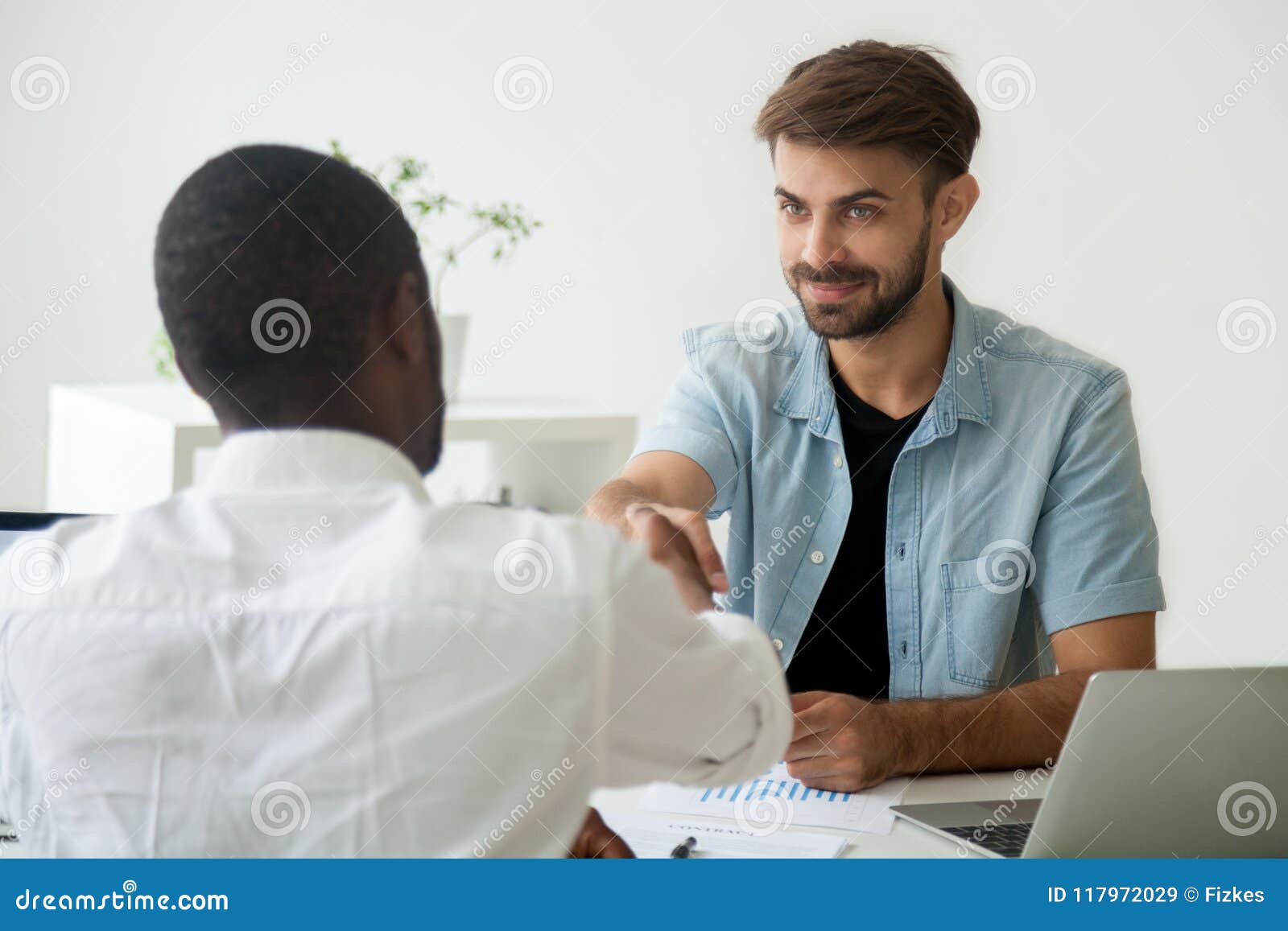 Friendly Caucasian Worker Greeting Black Job Candidate with Hand Stock ... Friendly Caucasian Worker Greeting Black Job Candidate with Hand Stock ...