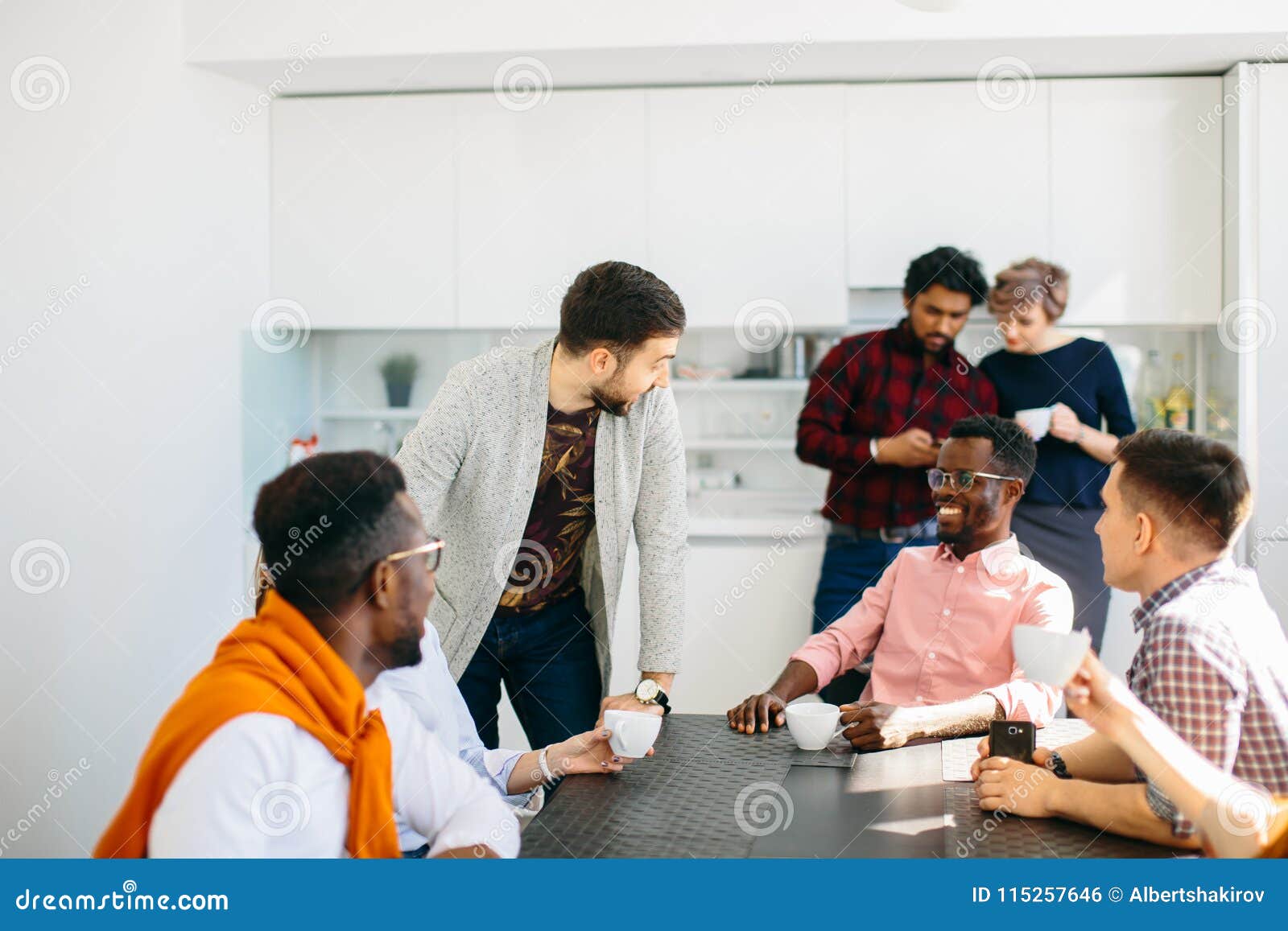 Friendly Conversation among Office Workers Over a Cup of Tea Stock ...