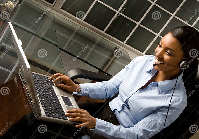 Friendly Customer Service Rep Stock Photo - Image of typing, desk: 2394330