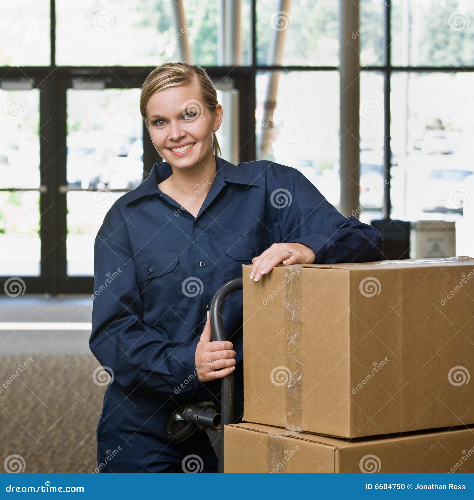 Friendly Delivery Woman in Uniform Stock Photo - Image of person ...