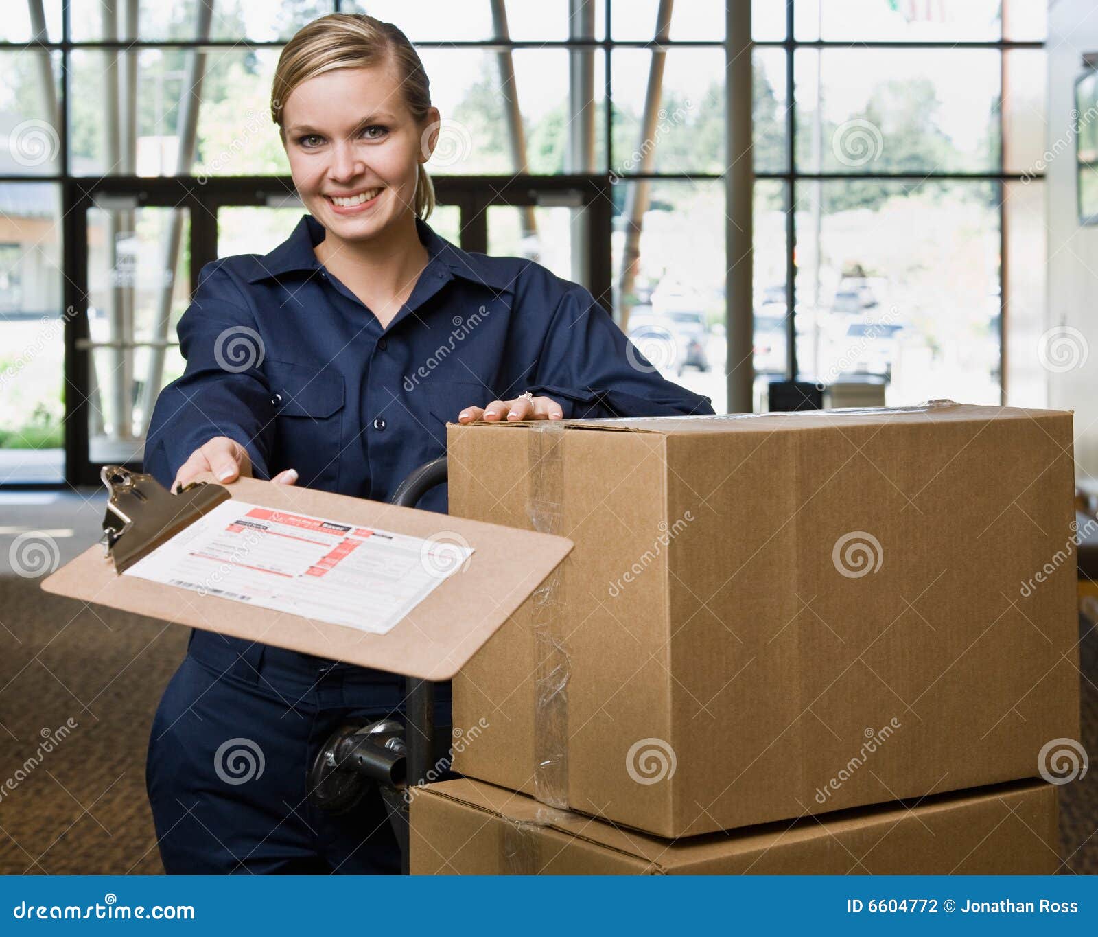 Friendly Delivery Woman in Uniform Stock Photo - Image of clothes ...