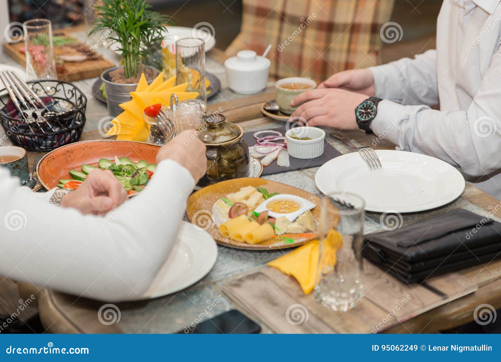 Friendly Dinner. Group of People Having Dinner Together while Sitting ...