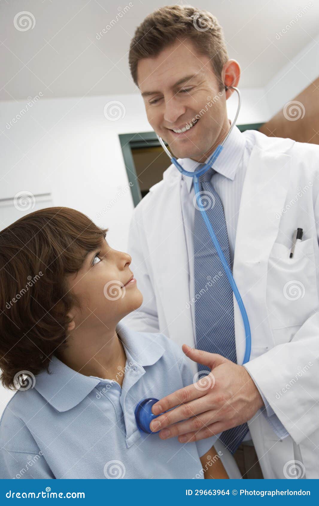 Friendly Doctor Examining Boy Stock Photo - Image of brunette, illness ...