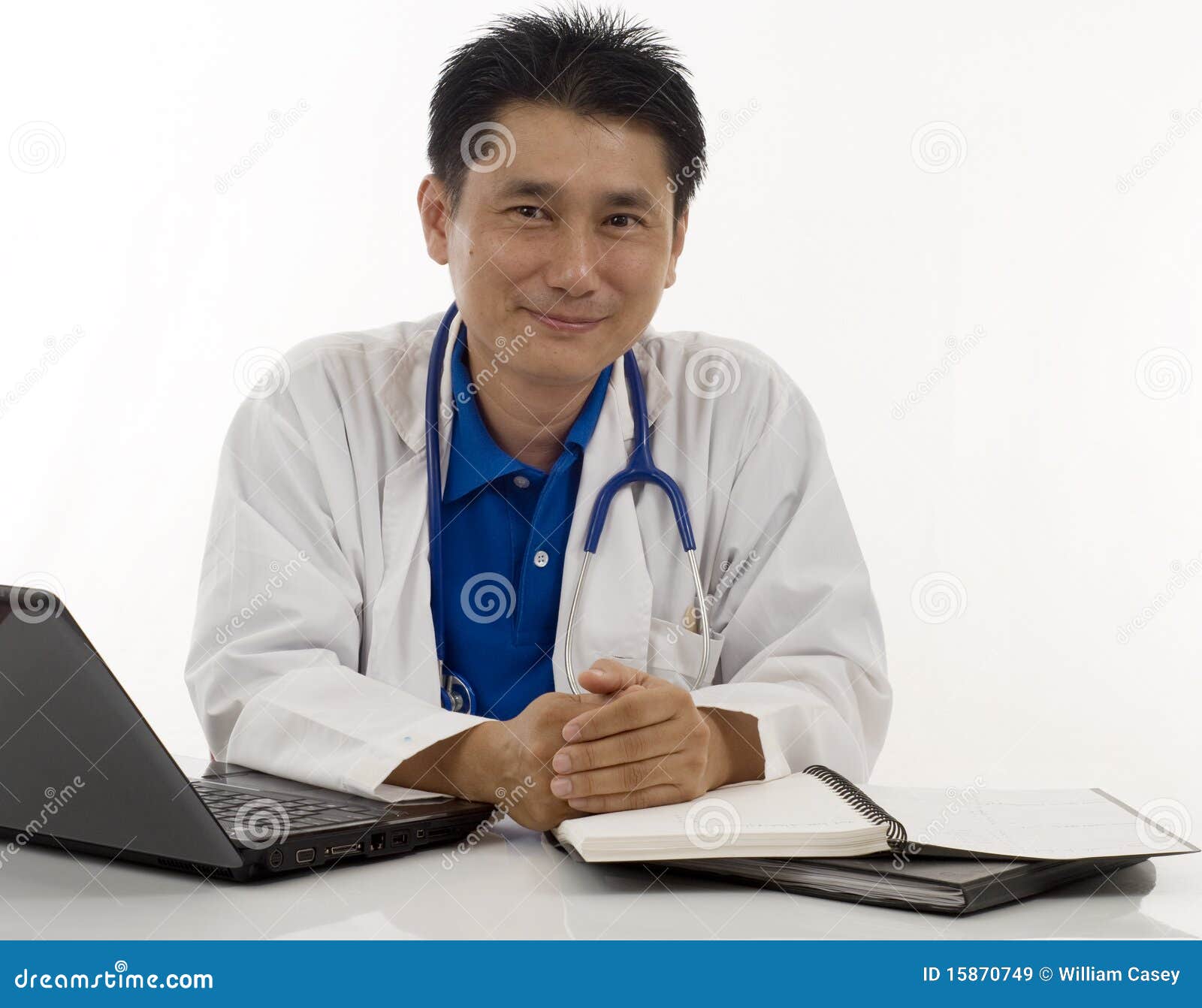 Friendly Doctor Sitting at His Desk Stock Image - Image of oriental ...