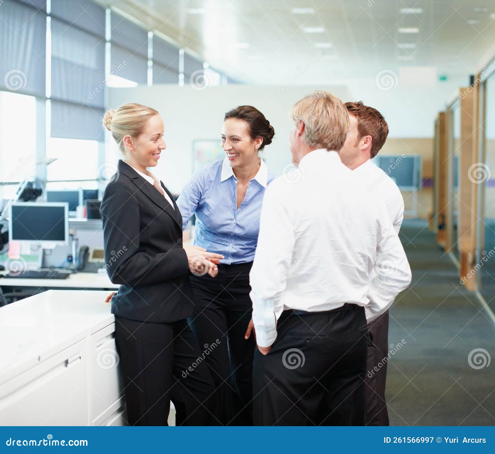 Friendly Executives in Office. Successful Business People Conversing ...