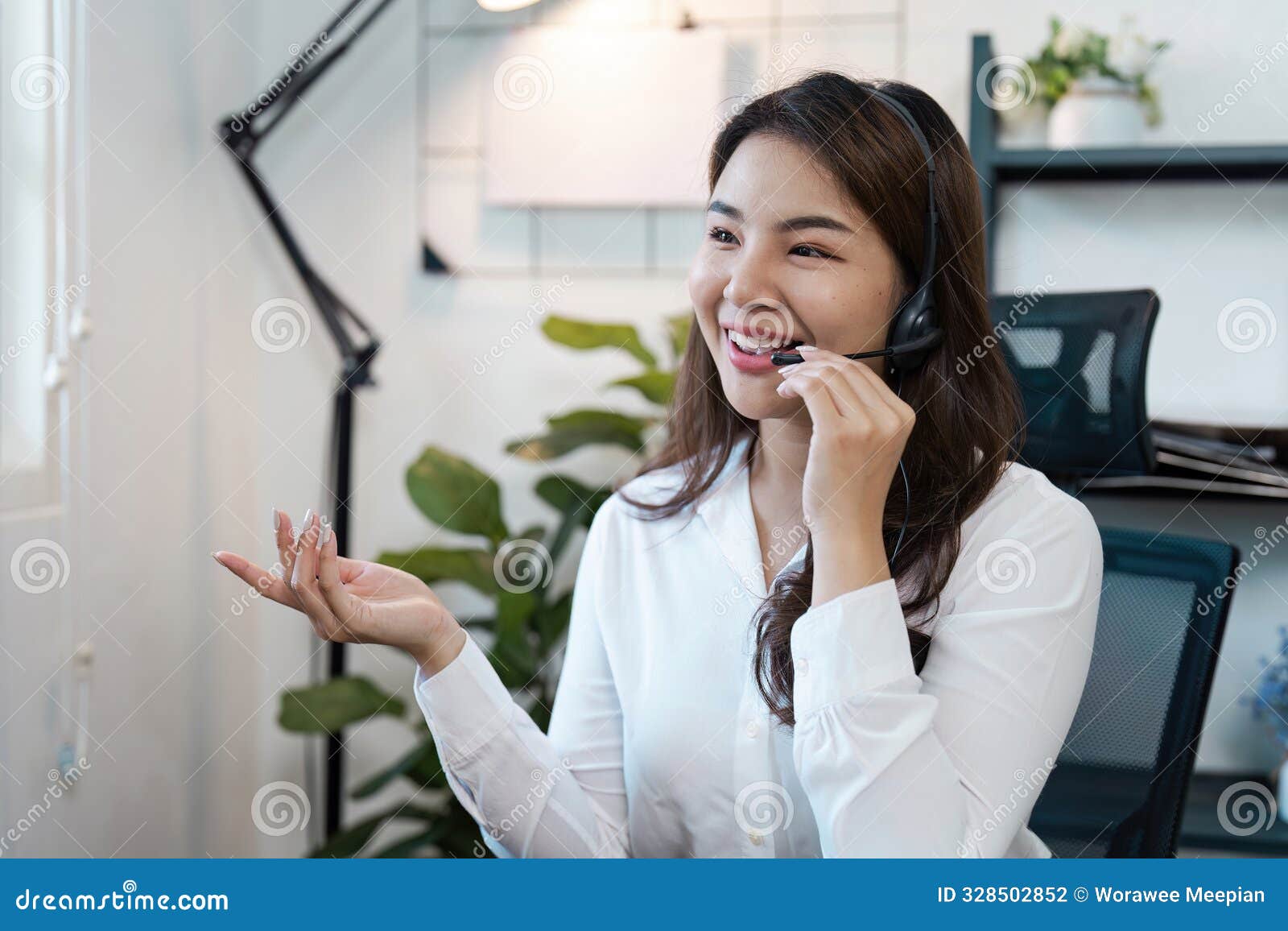 Friendly Female Call Center Agent Providing Customer Support in a ...