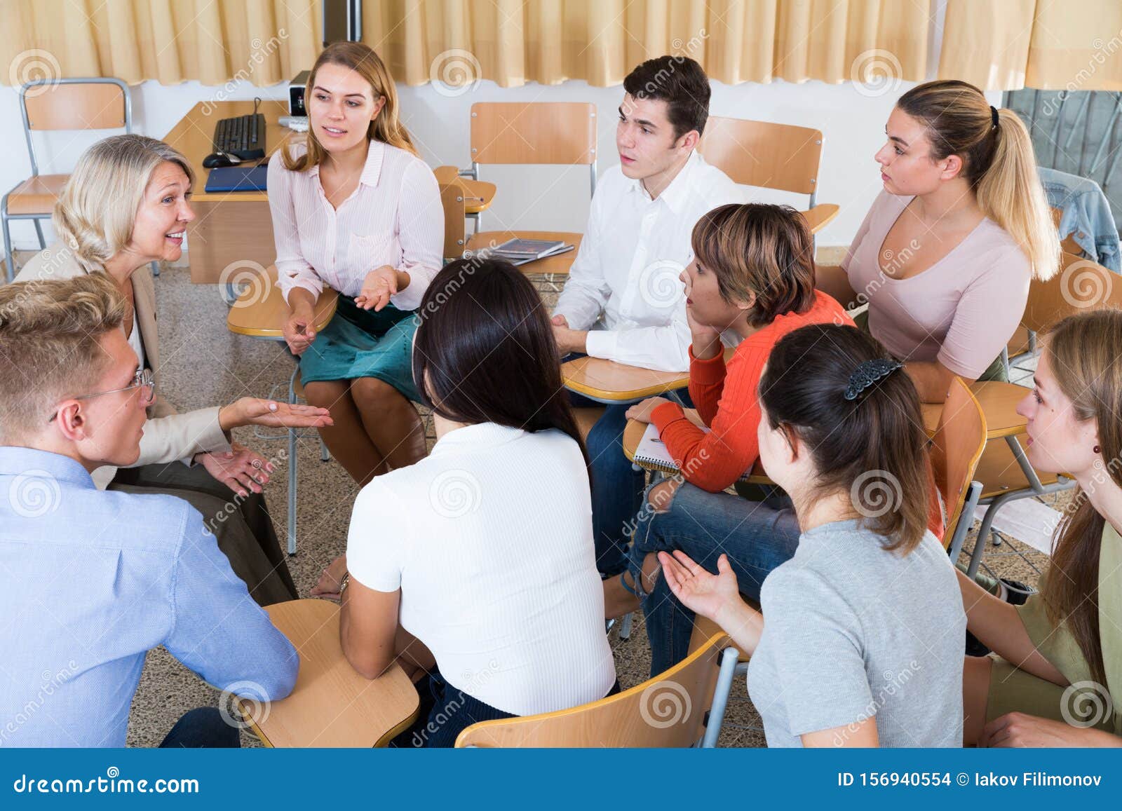 Group of Students Studying with Female Tutor Stock Photo - Image of ...