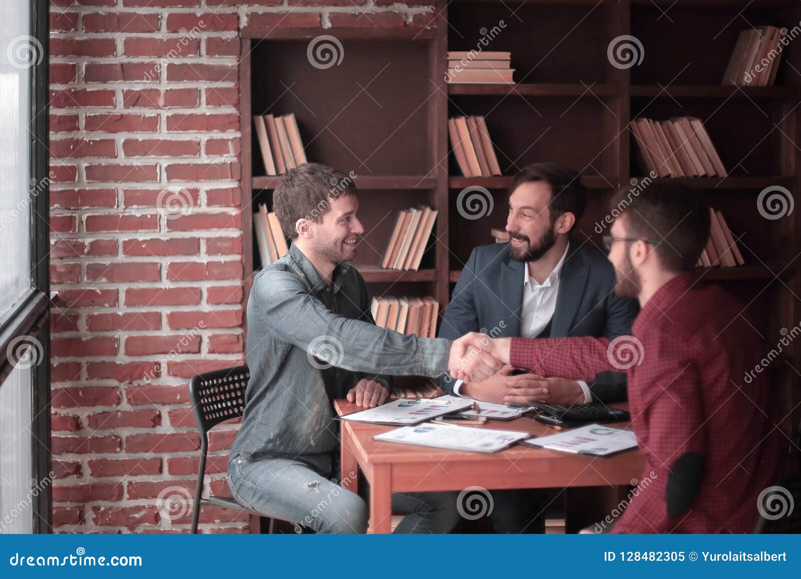 Friendly Handshake between Manager and Client in Creative Office. Stock ...