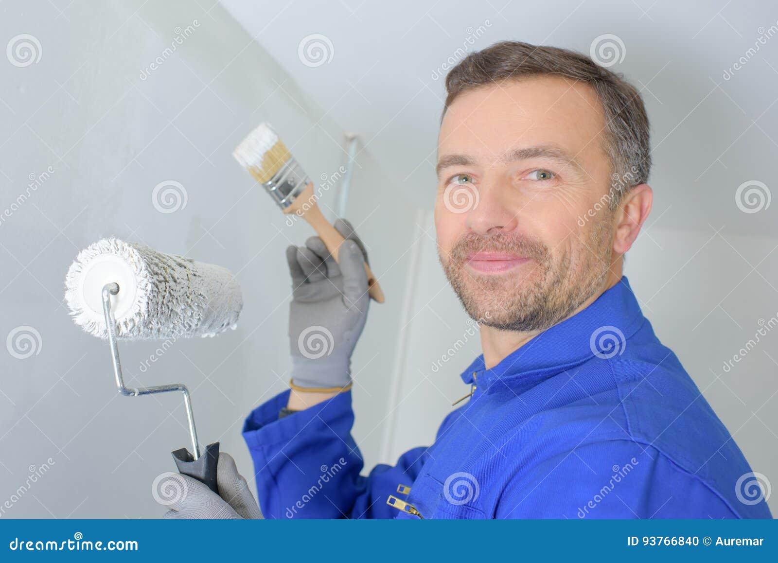 Friendly Handsome Painter Painting Wall in House Stock Photo - Image of ...