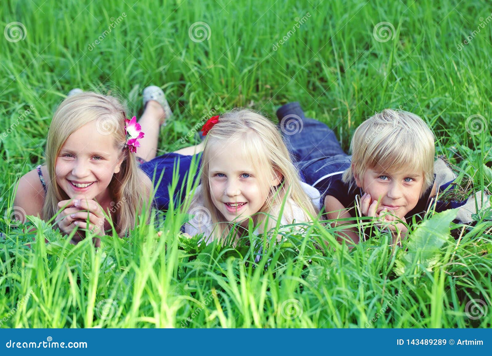 Friendly Kids Lying on Green Grass in Summer Park Stock Image - Image ...