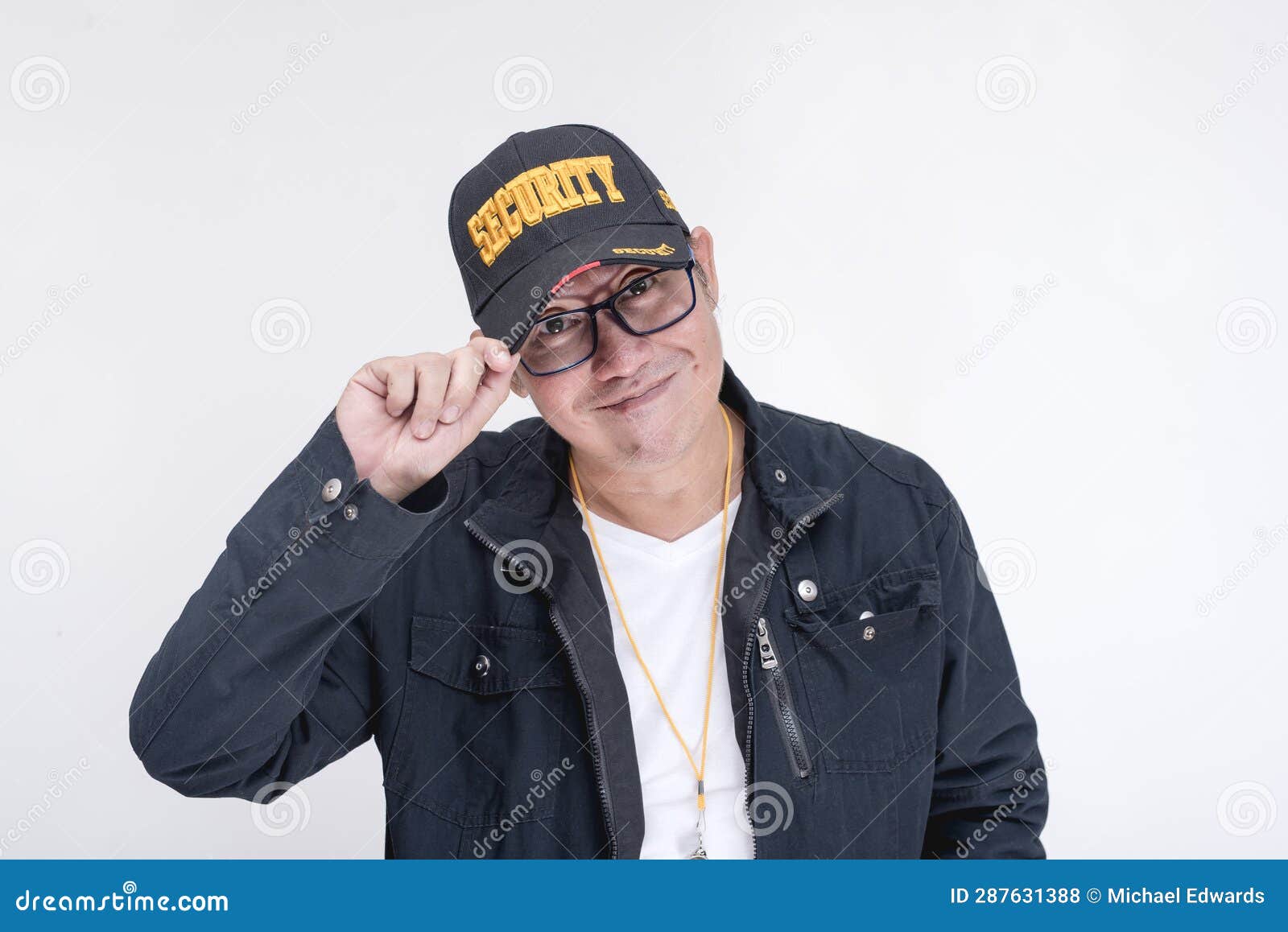A Friendly Male Security Guard Tips His Cap As Acknowledgment or As a ...
