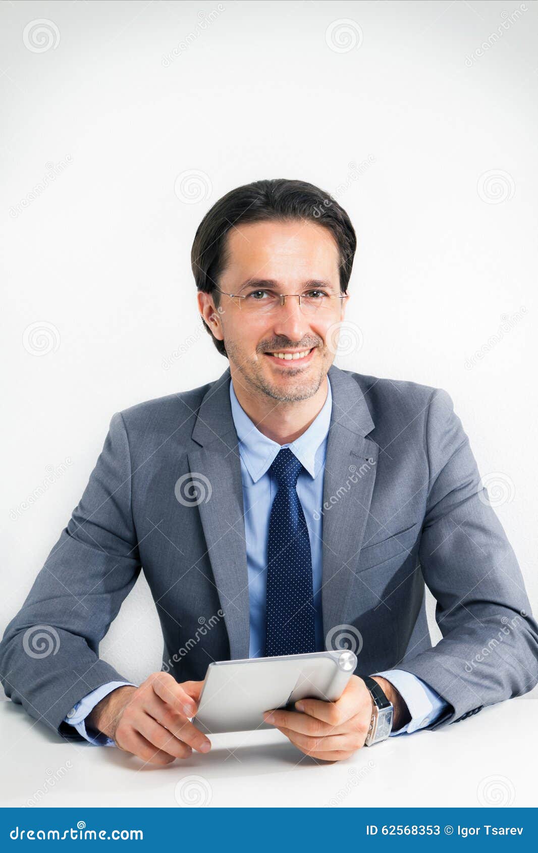 The Friendly Manager Wearing Spectacles Works with the Tablet Stock ...